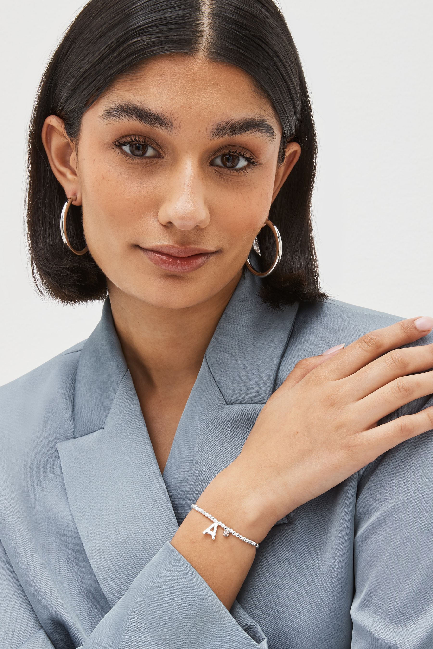 Buy Silver Tone Initial Sparkle Beaded Stretch Bracelet from the Next ...