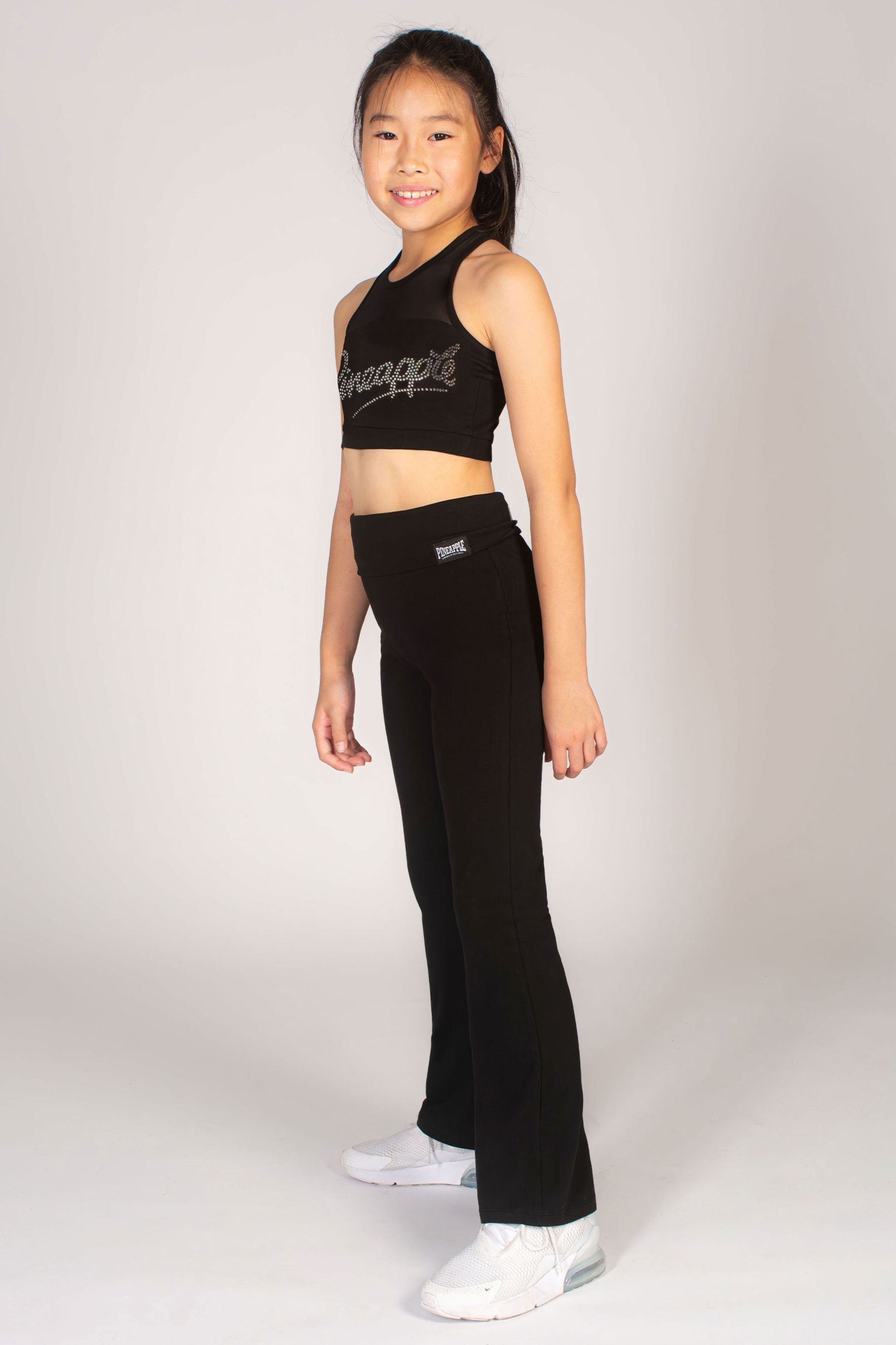 Buy Pineapple Black Foldover Waistband Girls Jersey Flare Trousers from ...
