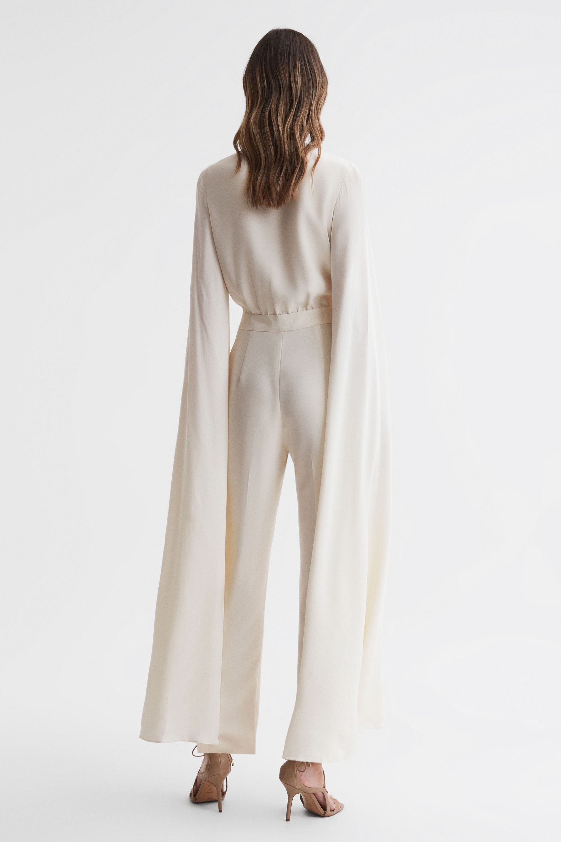 Buy Reiss Ivory Olivia Cape Sleeve V-Neck Jumpsuit from the Next UK ...