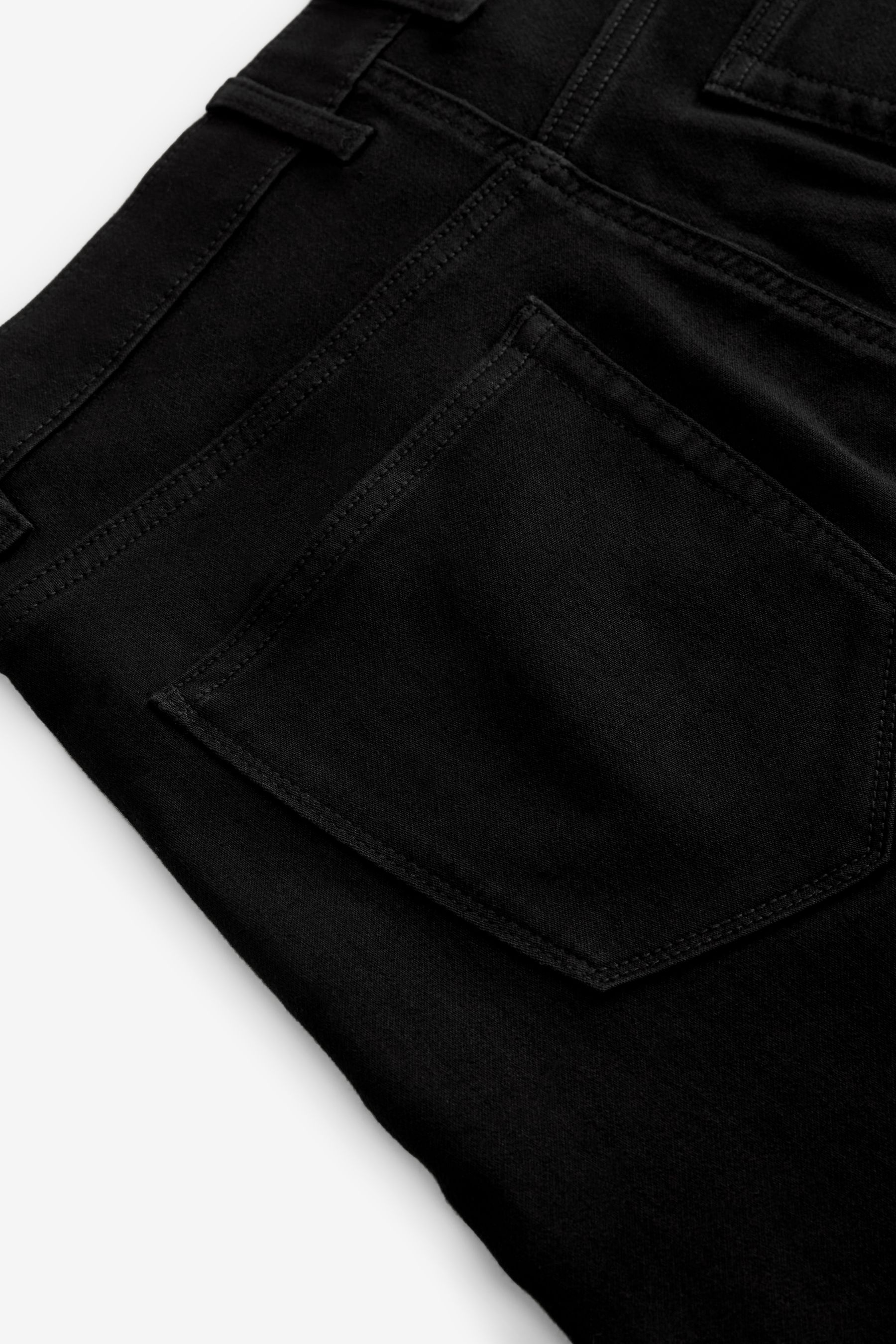 Buy Black Solid Slim Fit Comfort Stretch Jeans from the Next UK online shop