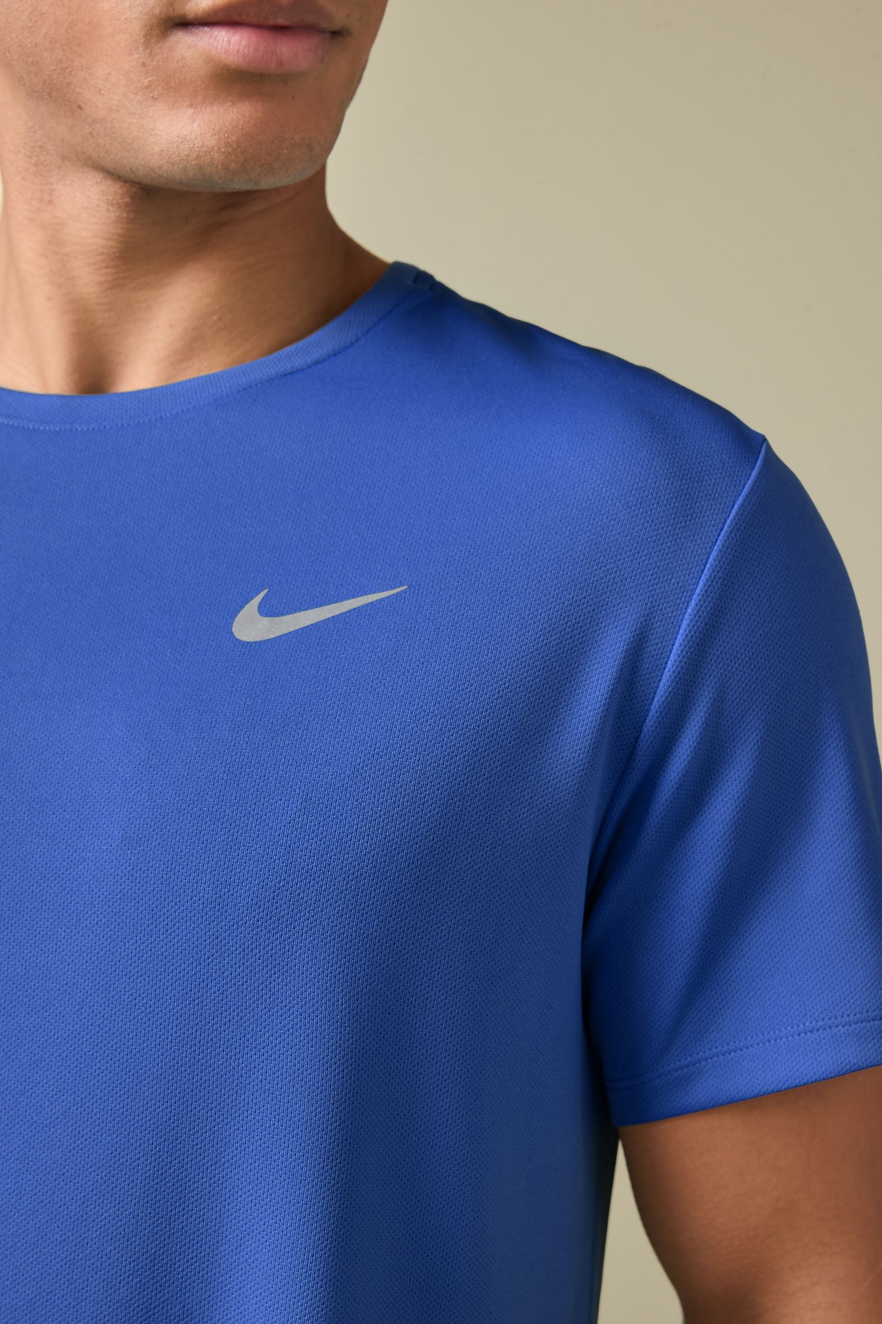 Buy Nike Dark Blue Miler Dri-FIT UV Running T-Shirt from the Next UK ...