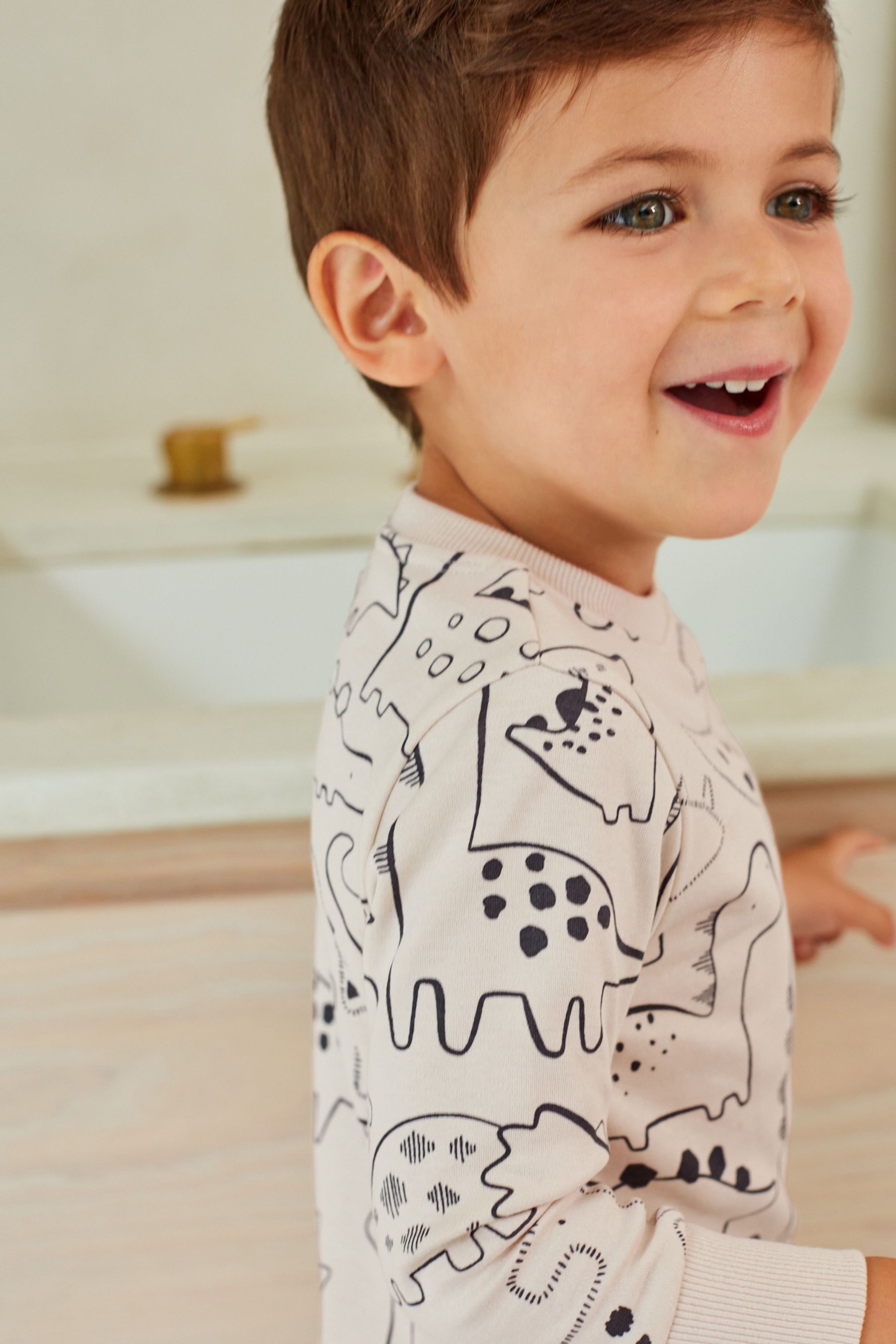 Buy Neutral/Black Dinosaur Snuggle Pyjamas 3 Pack (9mths-10yrs) from ...