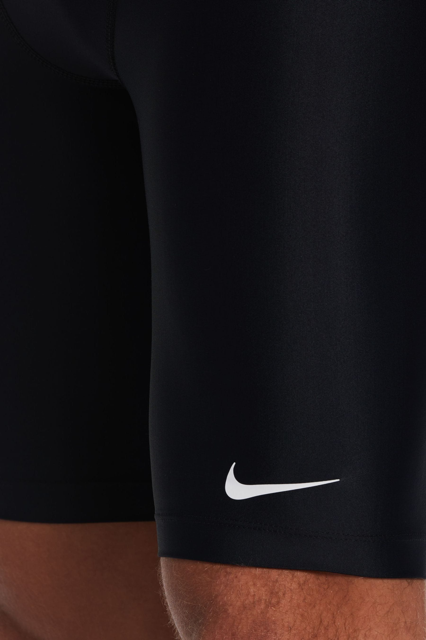 Buy Nike Black Logo Tape Jammer Performance Swim Shorts from the Next ...
