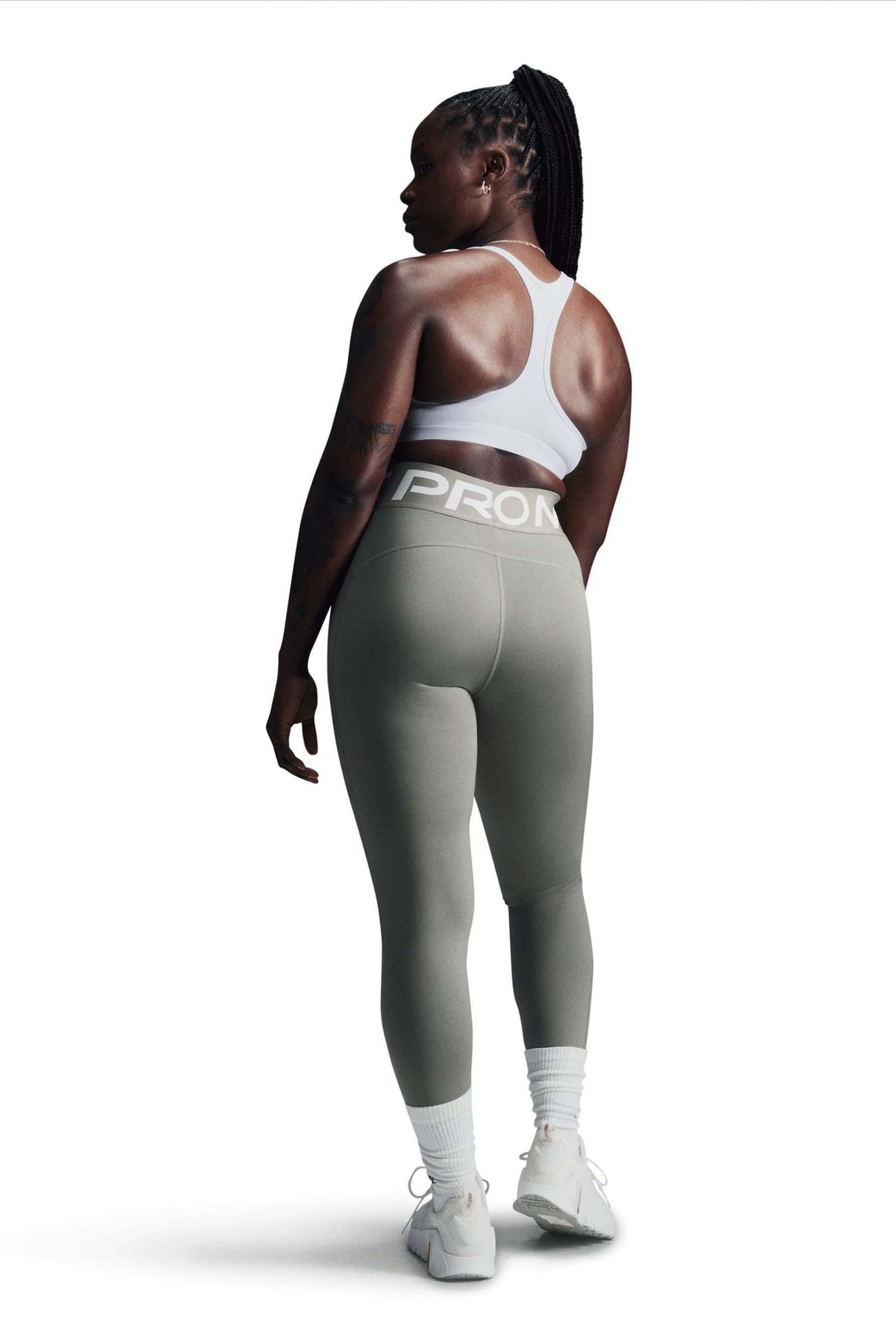 Buy Nike White Swoosh Light-Support Sports Bra from the Next UK online shop