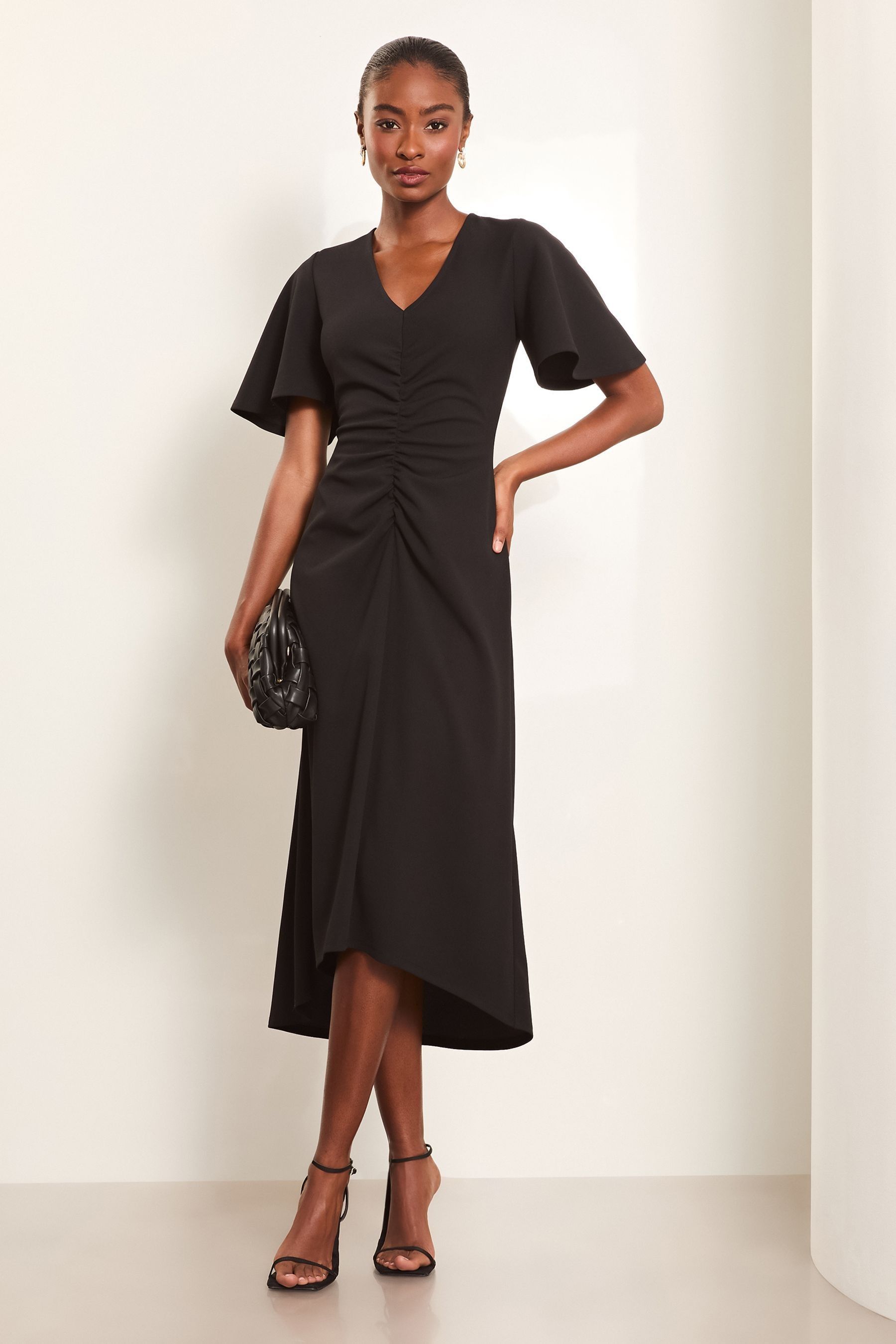 Buy Lipsy Black Short Sleeve V Neck Ruched Fit And Flare Midi Dress ...