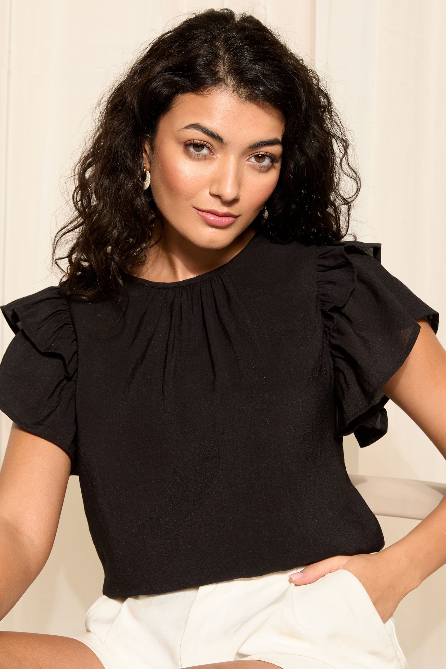 Buy Friends Like These Black Double Ruffle Short Sleeve Top from the ...