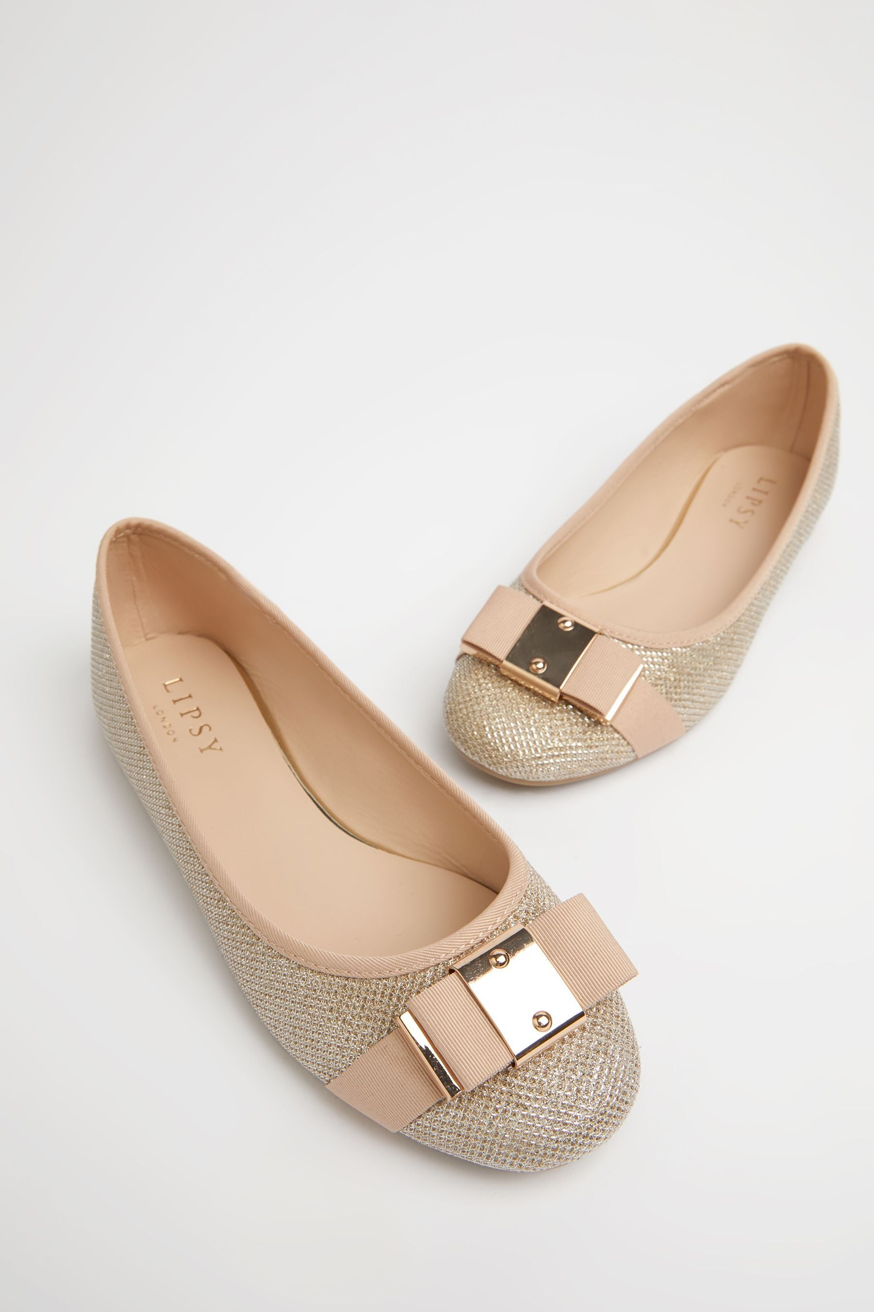 Buy Lipsy Gold Wide Fit Flat Bow Ballet Pumps from the Next UK online shop