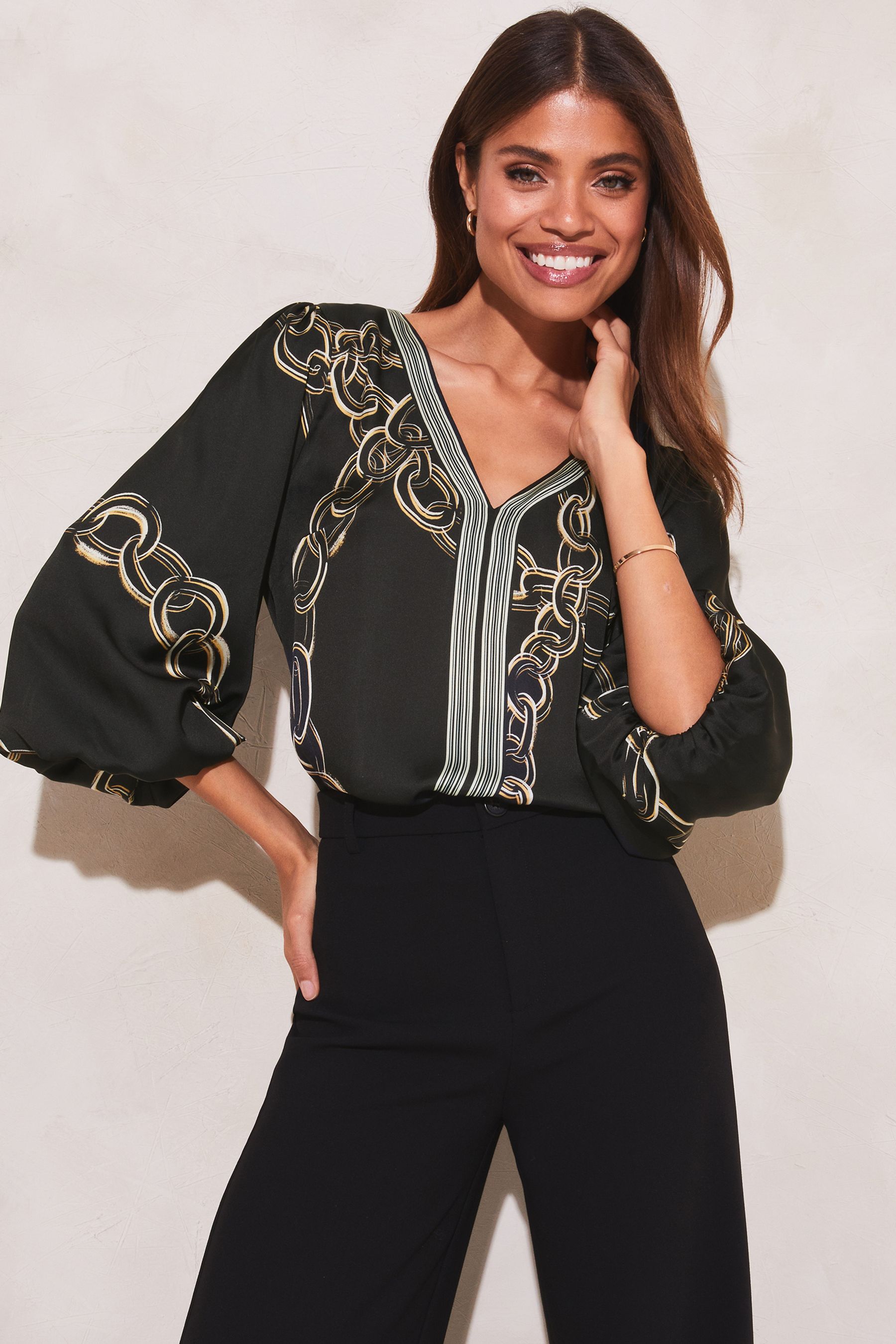 Buy Lipsy Black Print V Neck 3 4 Puff Sleeve Print Top From Next Ireland