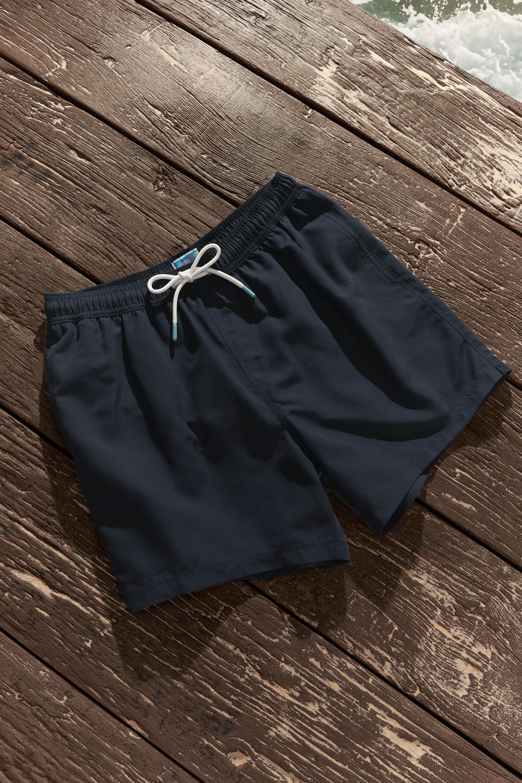 Buy Navy Blue Plain Essential Swim Shorts from the Next UK online shop