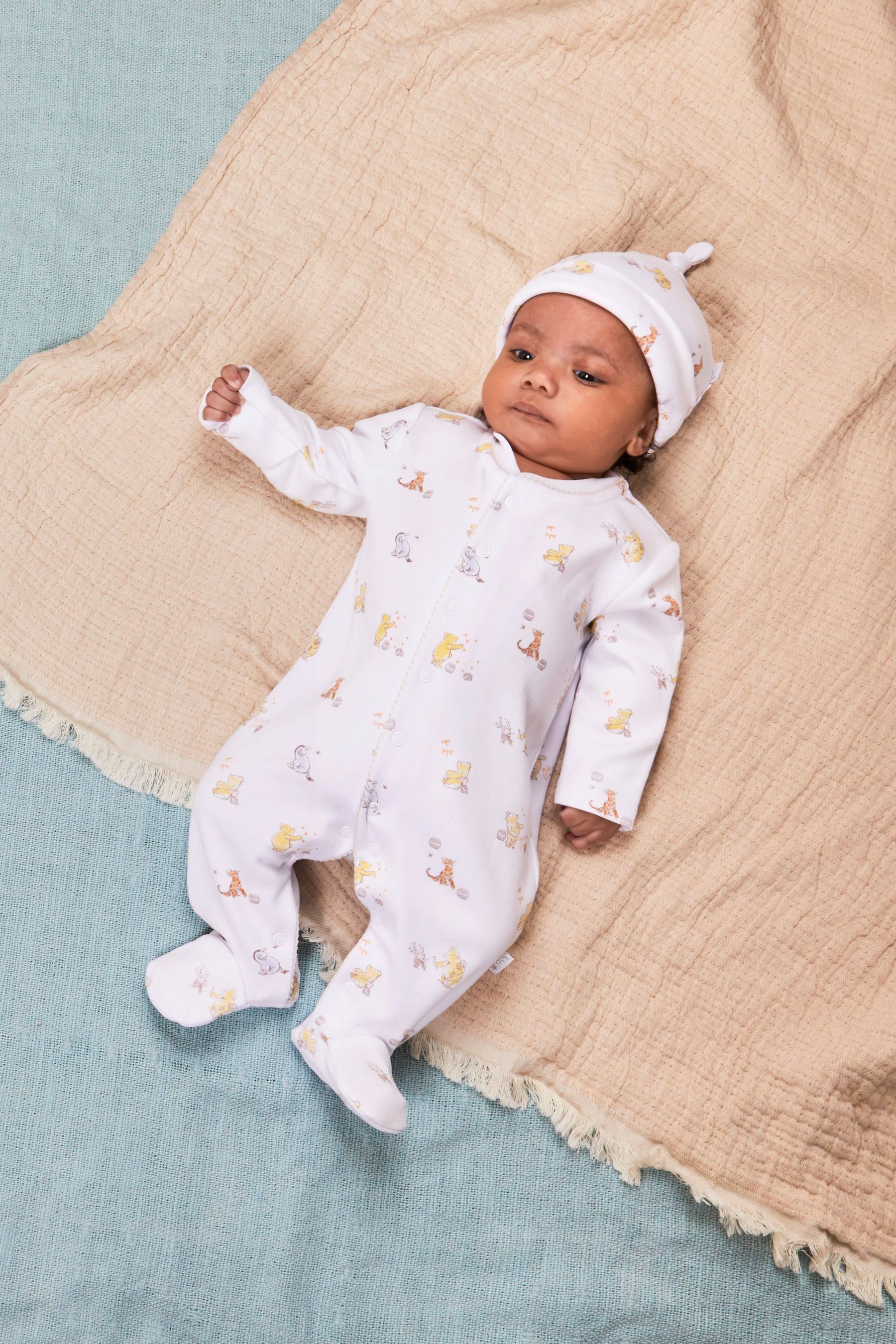 Buy JoJo Maman Bébé Cream Winnie The Pooh Print Sleepsuit & Hat Set ...