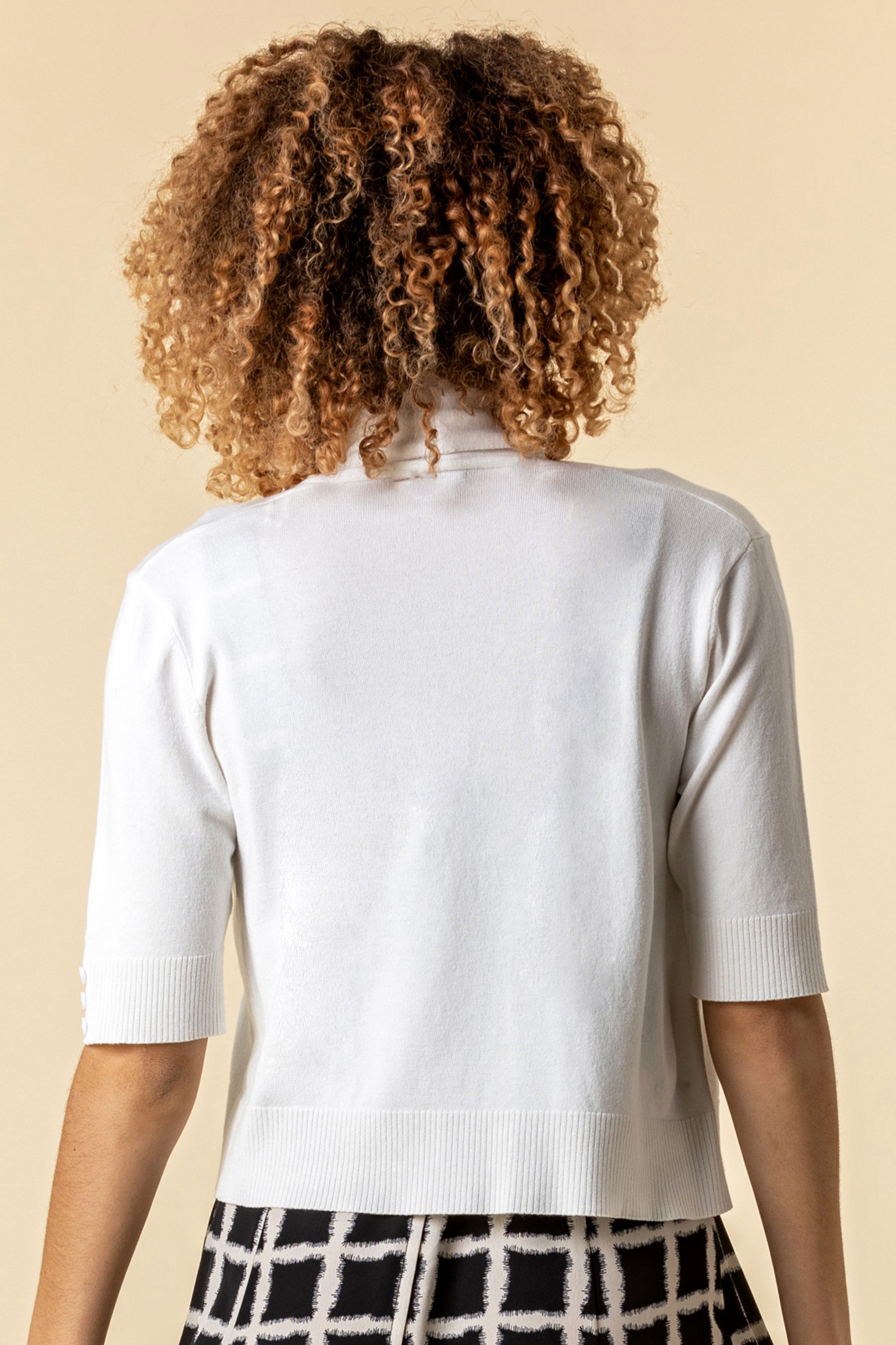 Buy Roman Cream Button Detail Collared Shrug from the Next UK online shop