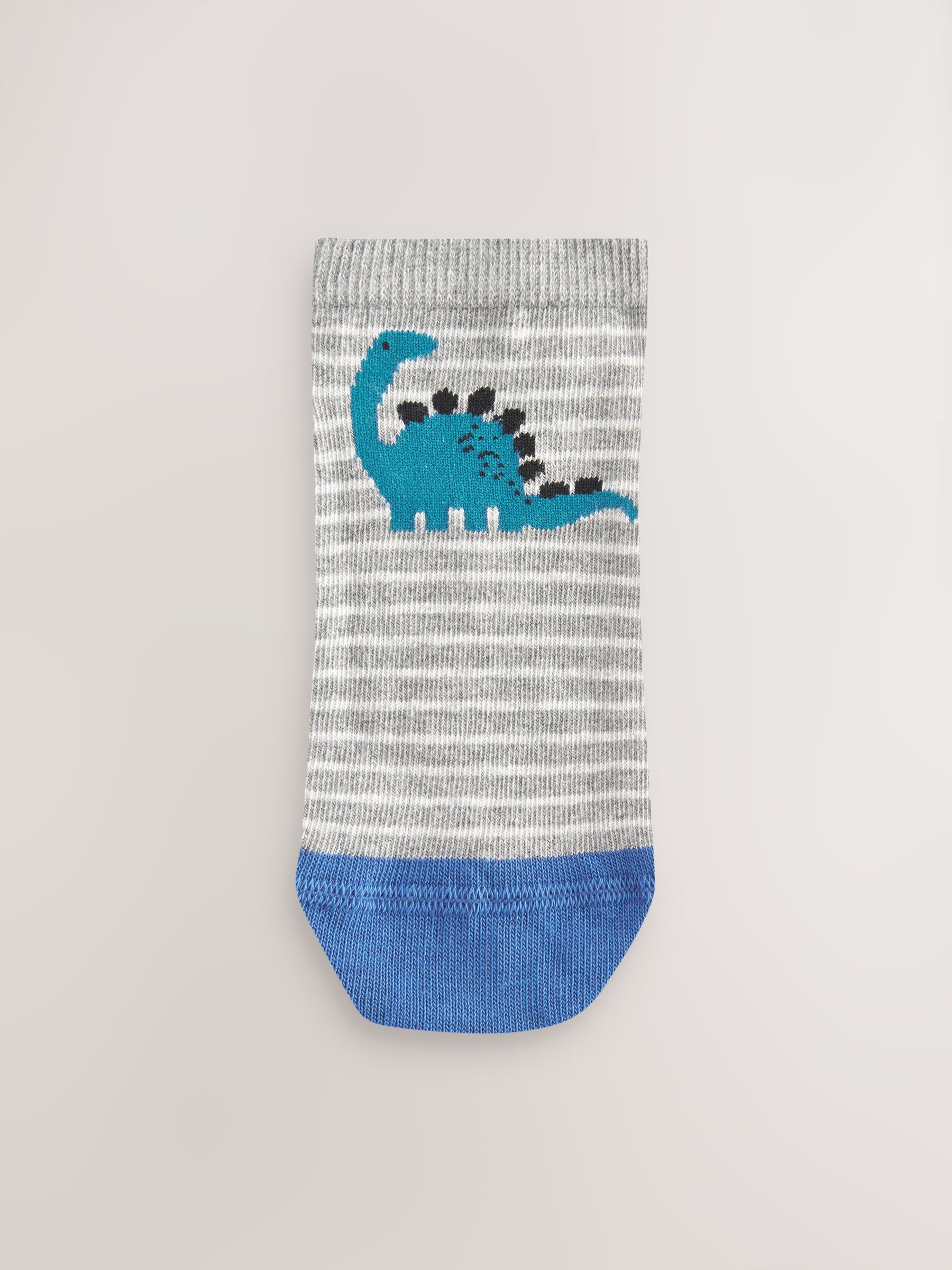 Buy Blue Dinos Cotton Rich Trainer Socks 7 Pack from the Next UK online ...