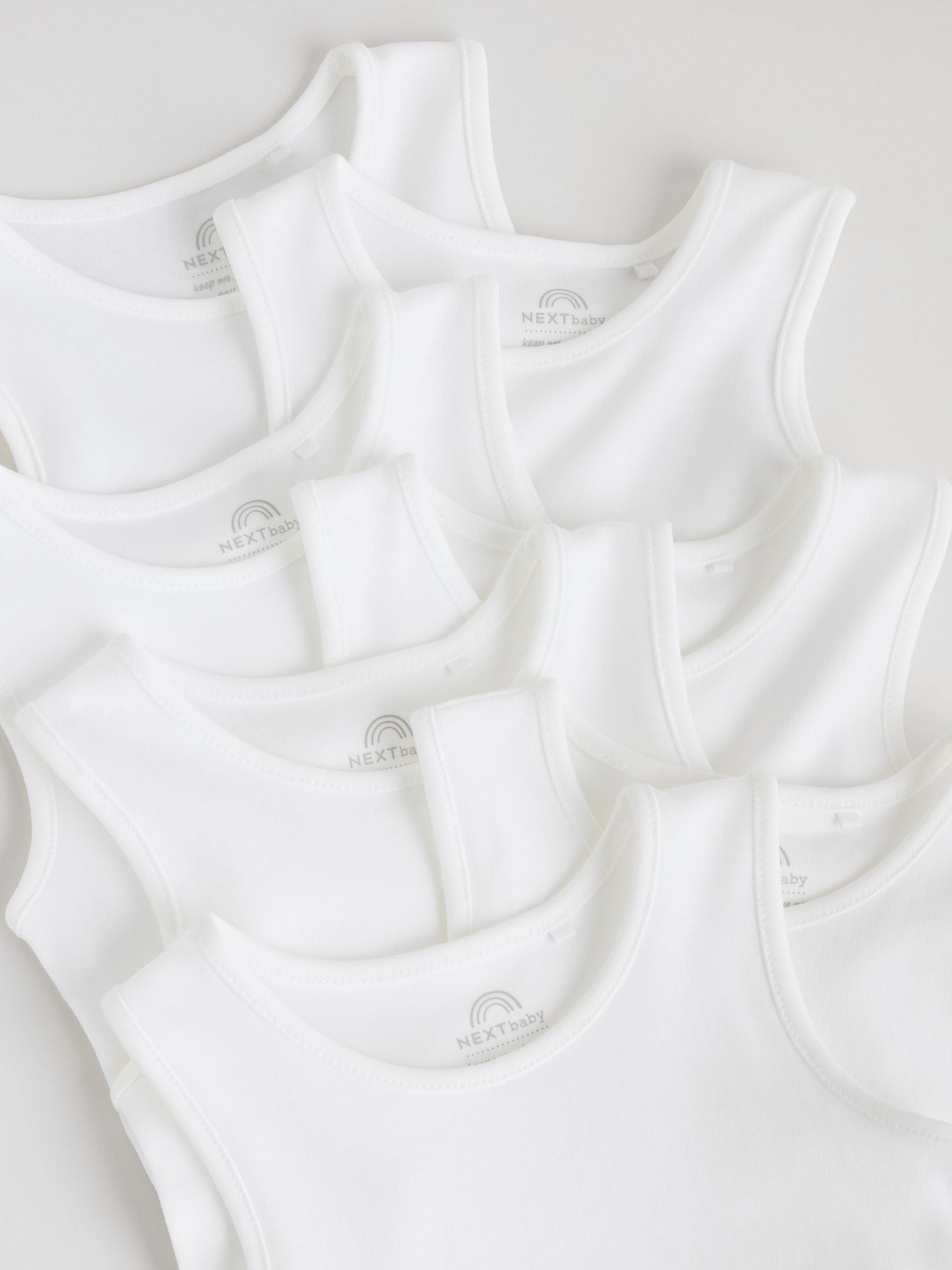 Buy White 7 Pack Baby Vest Bodysuits from the Next UK online shop