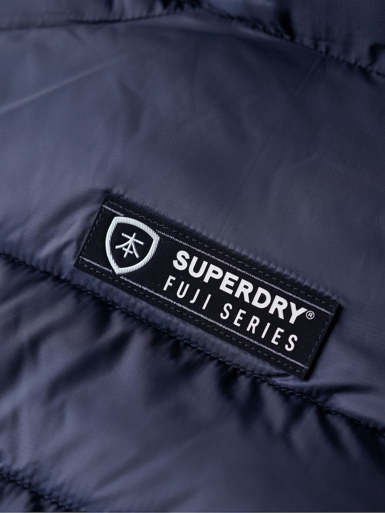 Buy Superdry Eclipse Navy Hooded Fuji Quilt Padded Gilet Jacket from the Next UK online shop