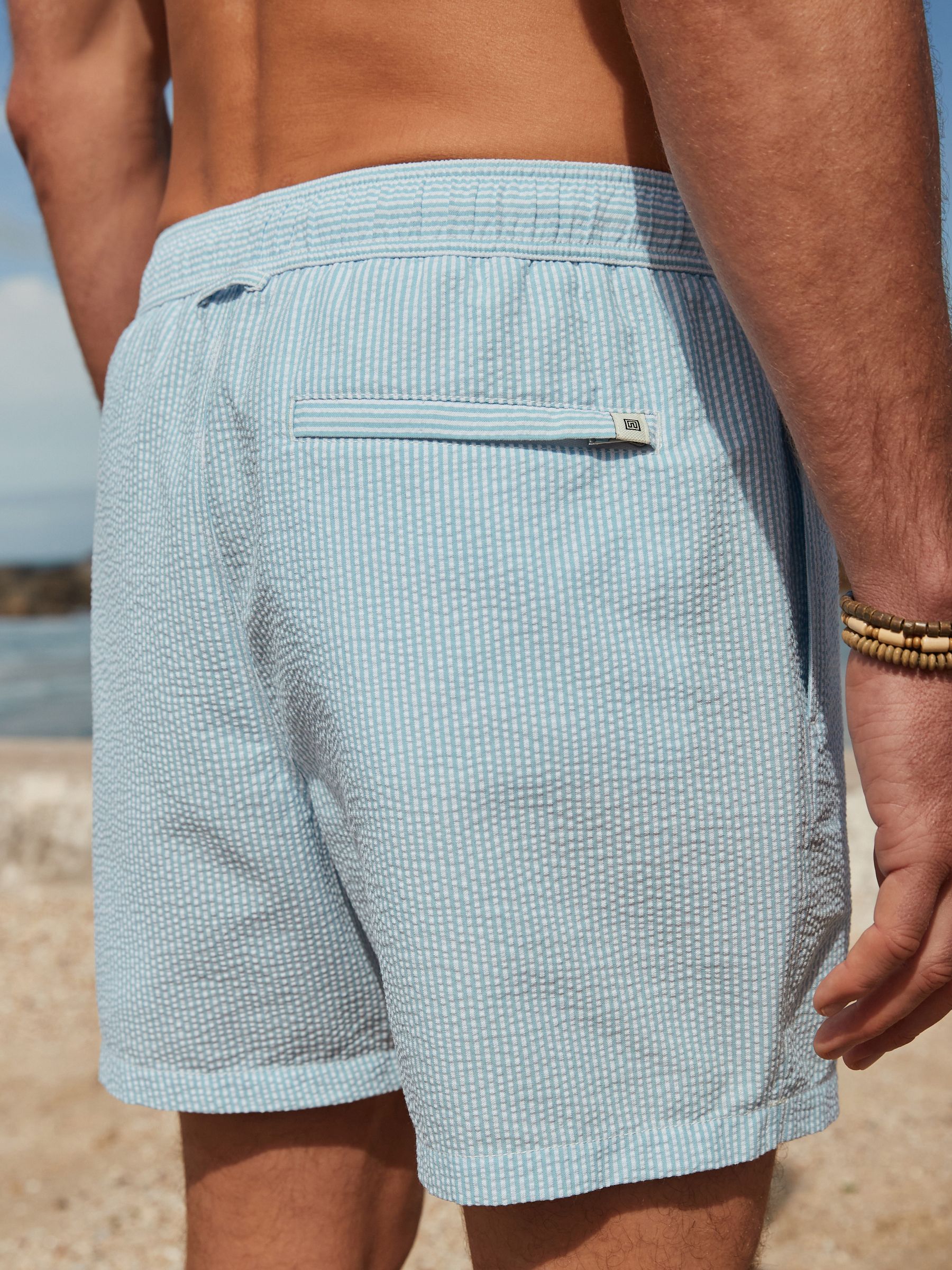 Buy Blue and White Seersucker Striped Premium Swim Shorts from the Next ...