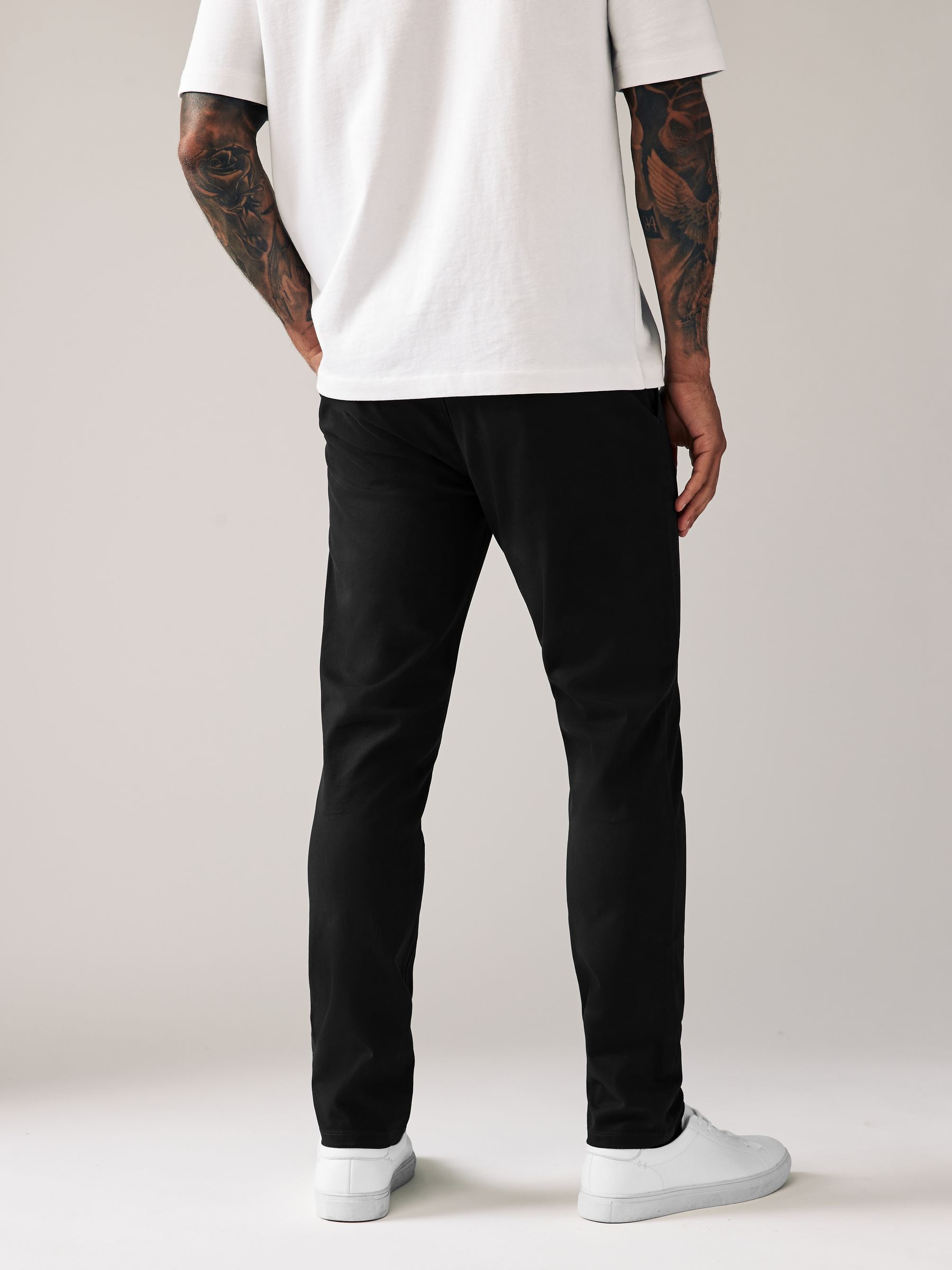 Buy Black Skinny Fit Stretch Chinos Trousers from Next Saudi Arabia