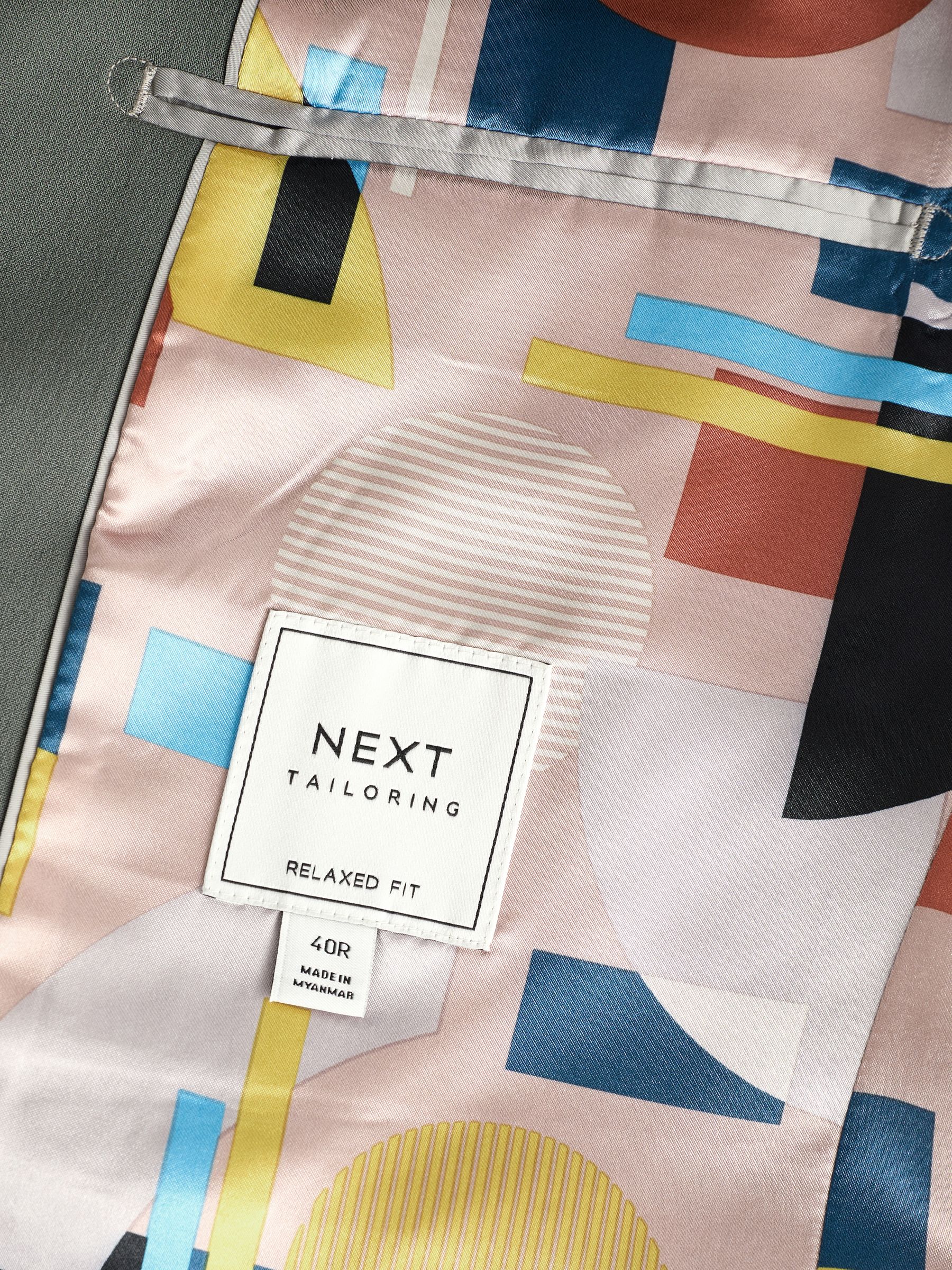 Buy Green Relaxed Fit Motionflex Stretch Suit Jacket from the Next UK ...