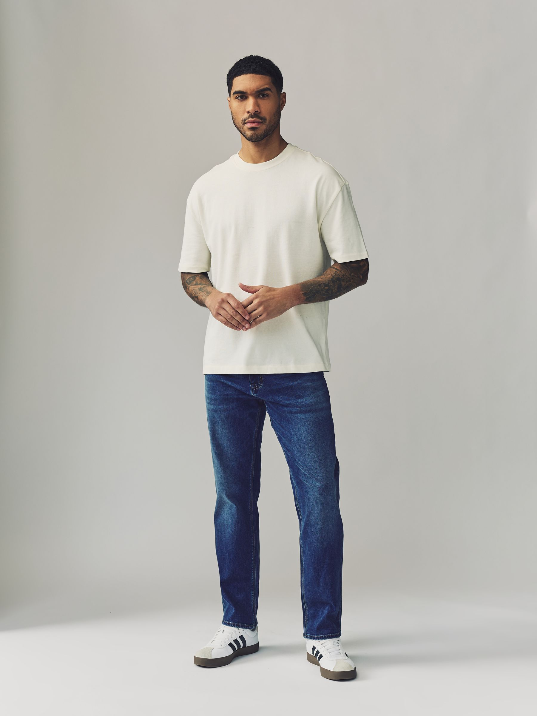 Buy Blue Straight Fit Lightweight Motion Flex Denim Jeans from the Next ...