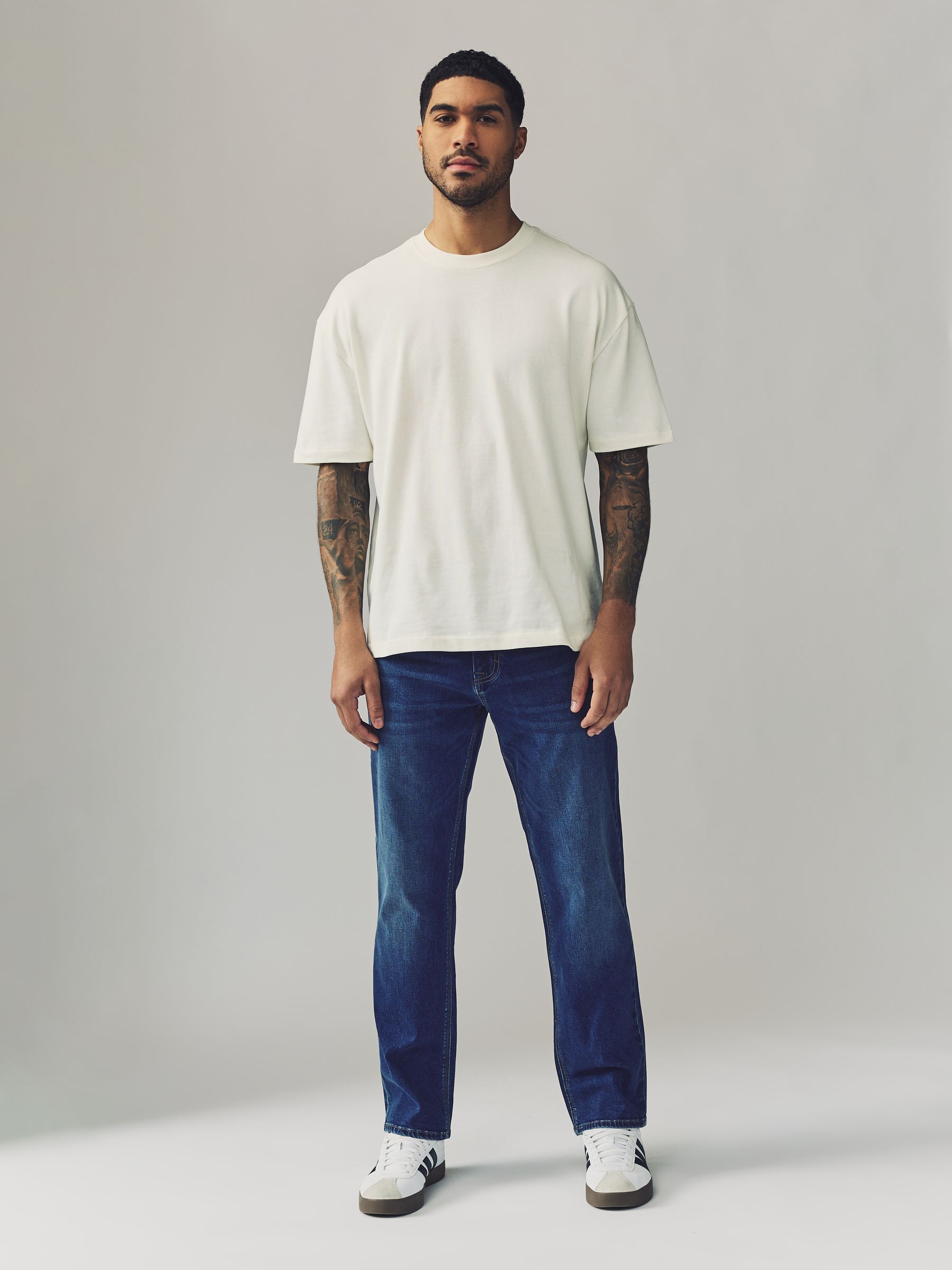 Buy Blue Straight Fit Lightweight Motion Flex Denim Jeans from the Next UK online shop