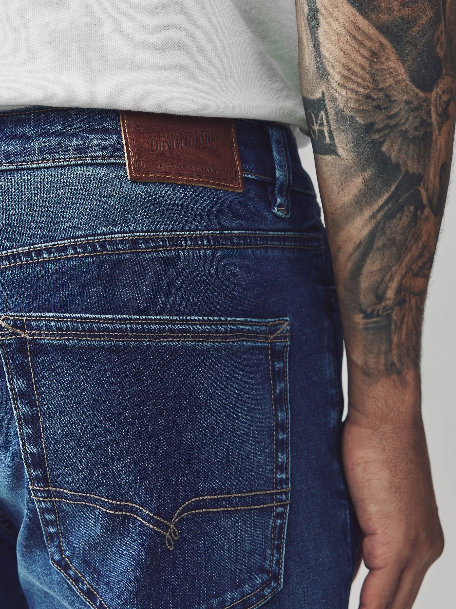 Buy Blue Straight Fit Lightweight Motion Flex Denim Jeans from the Next ...