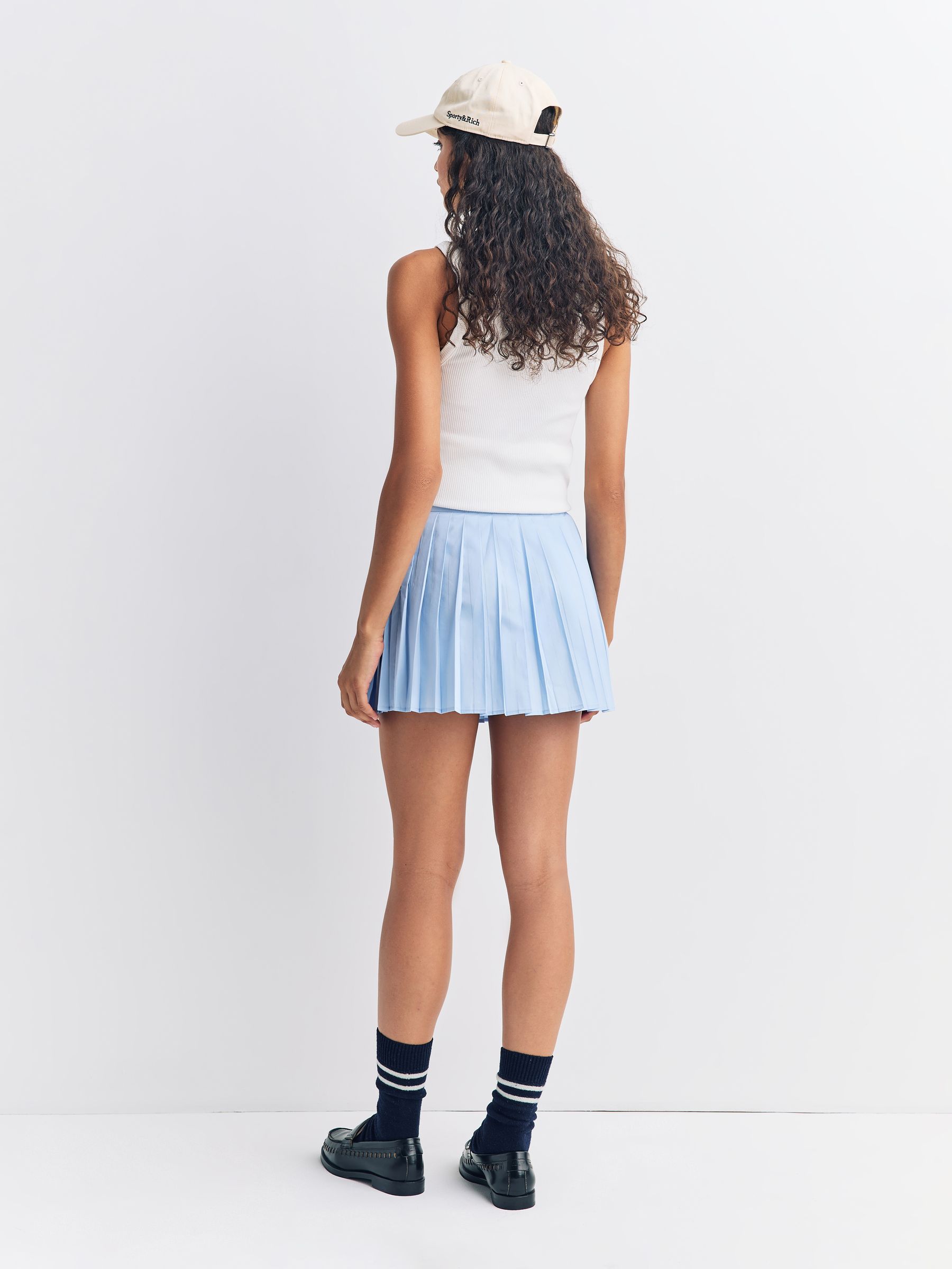 Buy Sporty & Rich Blue Serif Logo Anae Skirt from the Next UK online shop