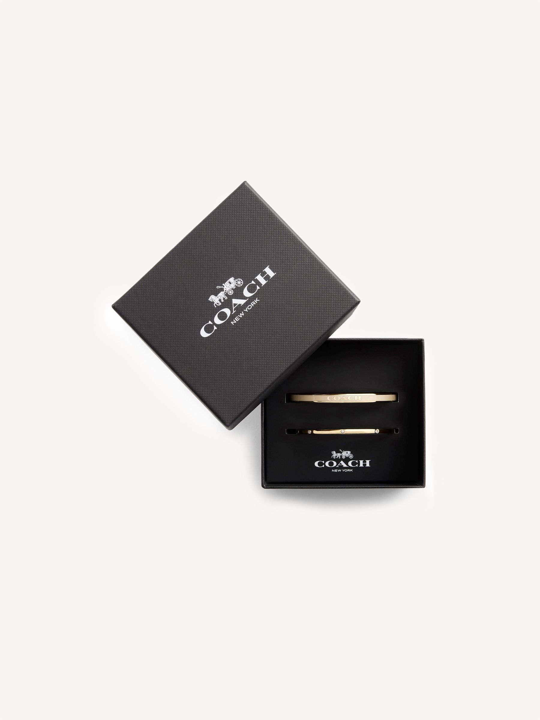 Buy COACH Gold/White COACH Gold Tone Signature Duo Boxed Bangle Set ...