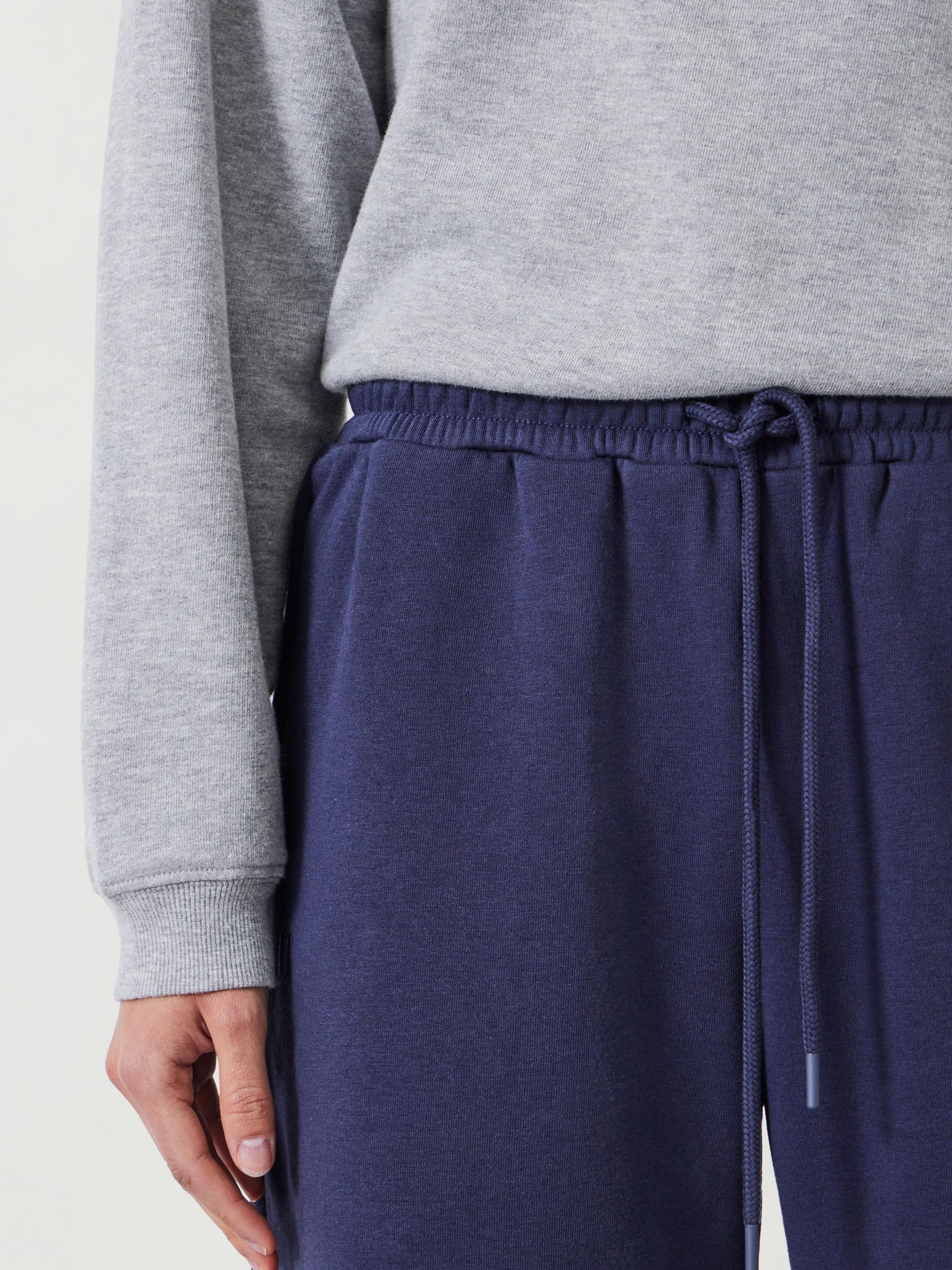 Buy Hush Blue Alyna Pocket Detail Relaxed Joggers from the Next UK ...