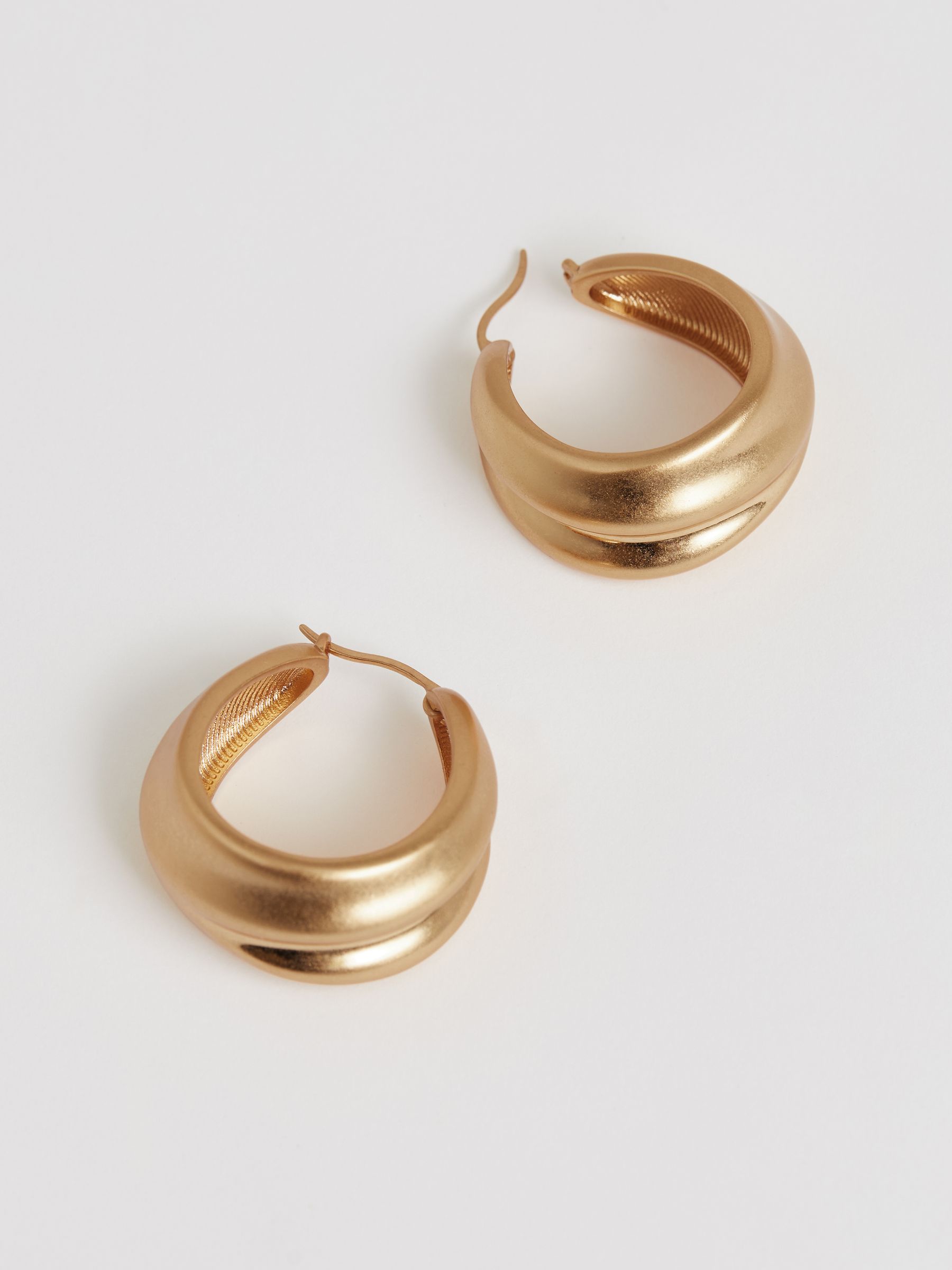 Buy Reiss Gold Tone Sophie Sculptural Hoop Earrings from the Next UK ...
