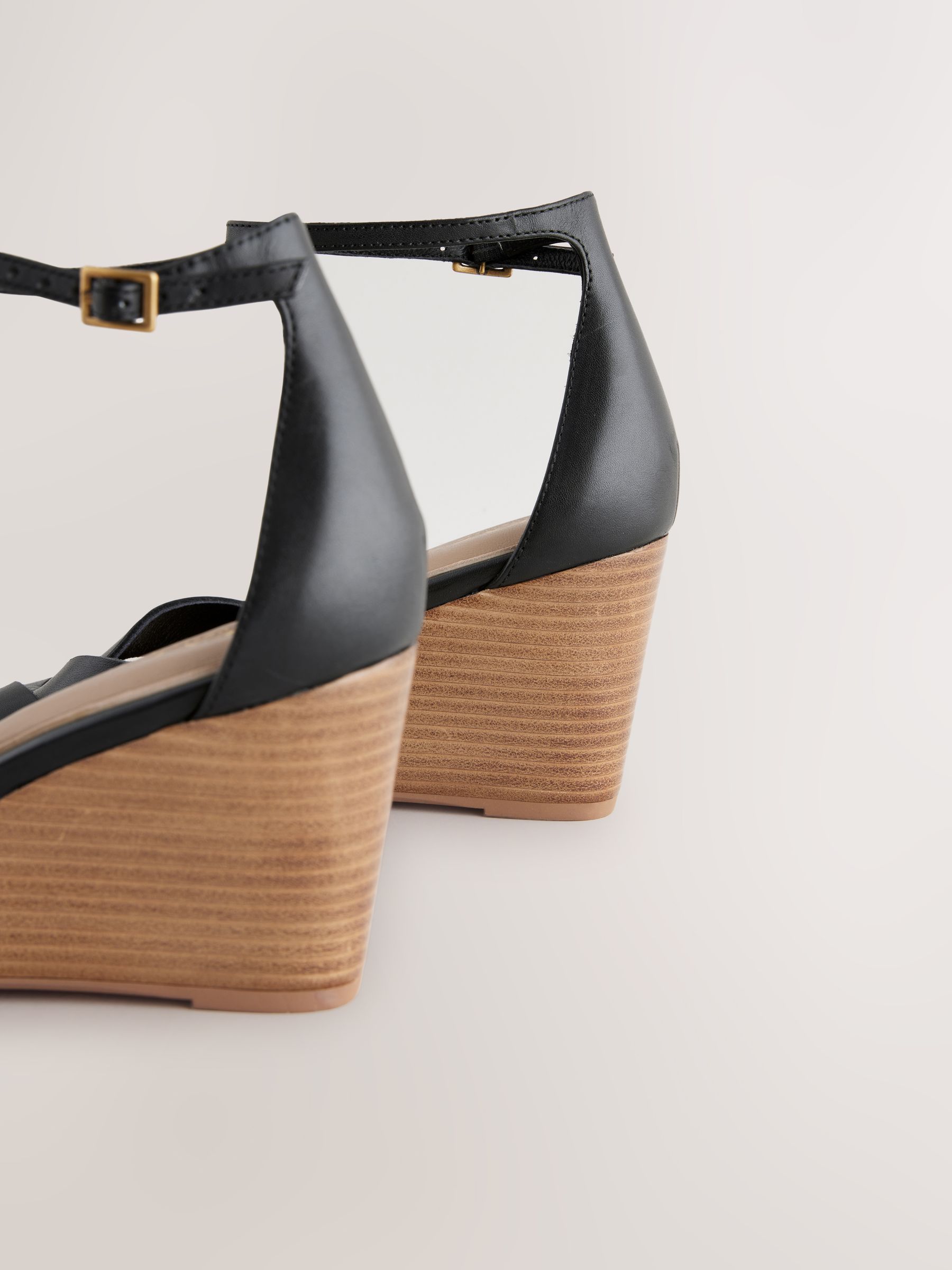 Buy Black Premium Leather With Motionflex Strap Detail Wedges from Next ...
