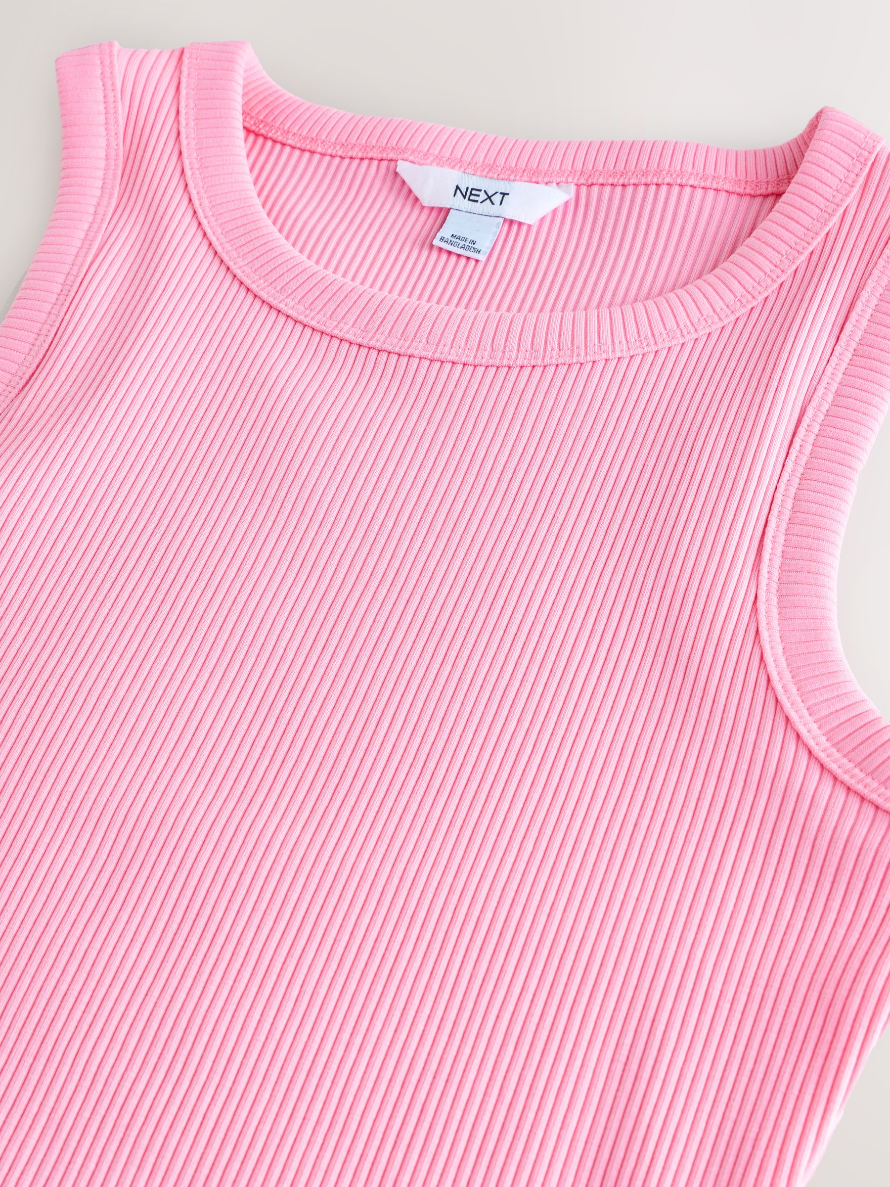 Buy Fluro Pink Ribbed Racer Tank Vest Sleeveless Top from the Next UK ...