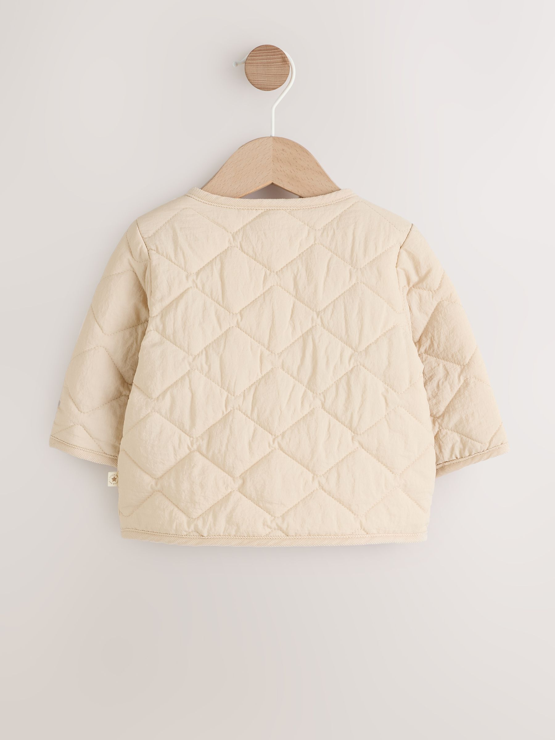 Buy Neutral Quilted Popper Baby Jacket from the Next UK online shop