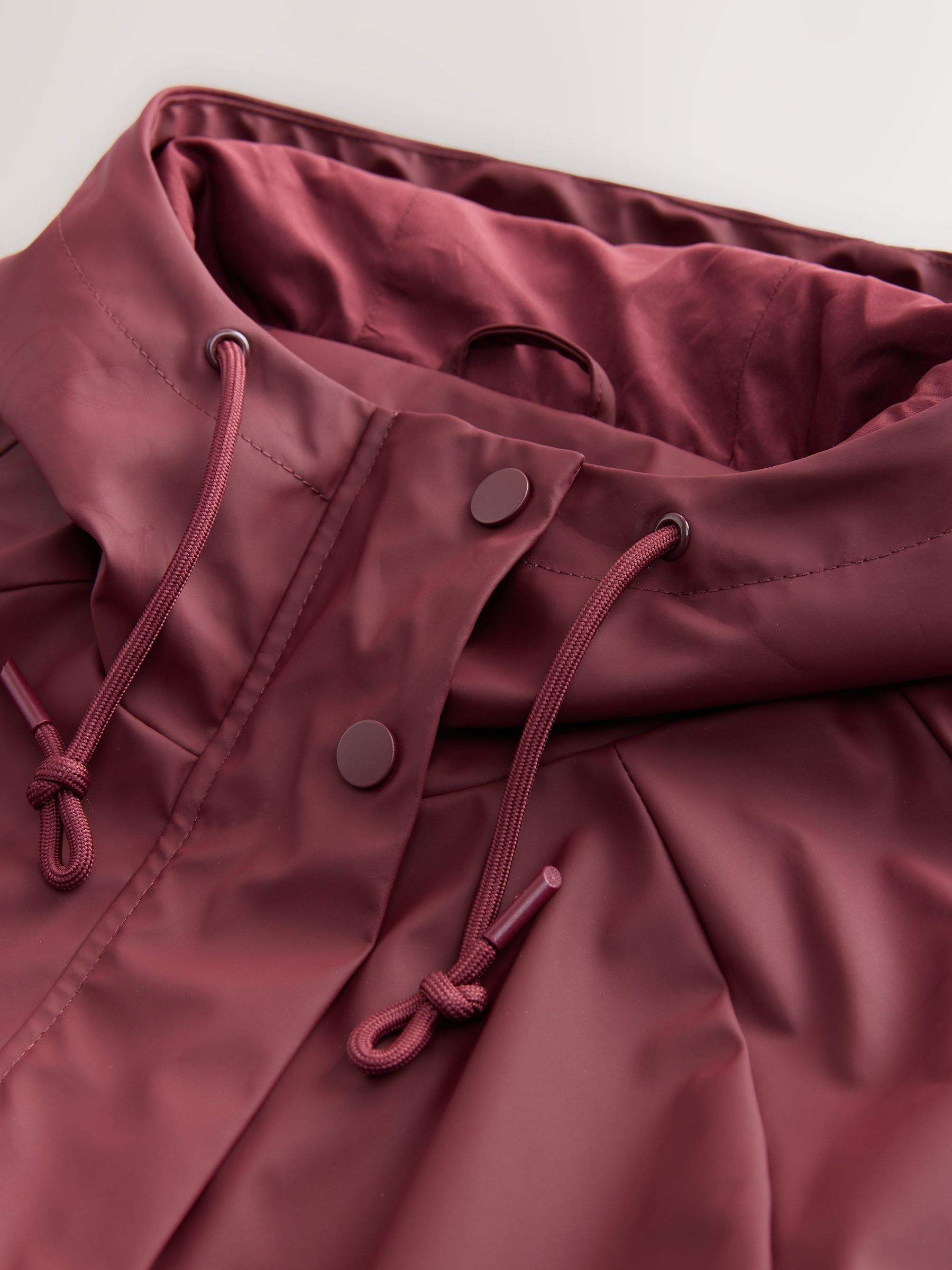 Buy Burgundy Red Rubber Rain Jacket from the Next UK online shop