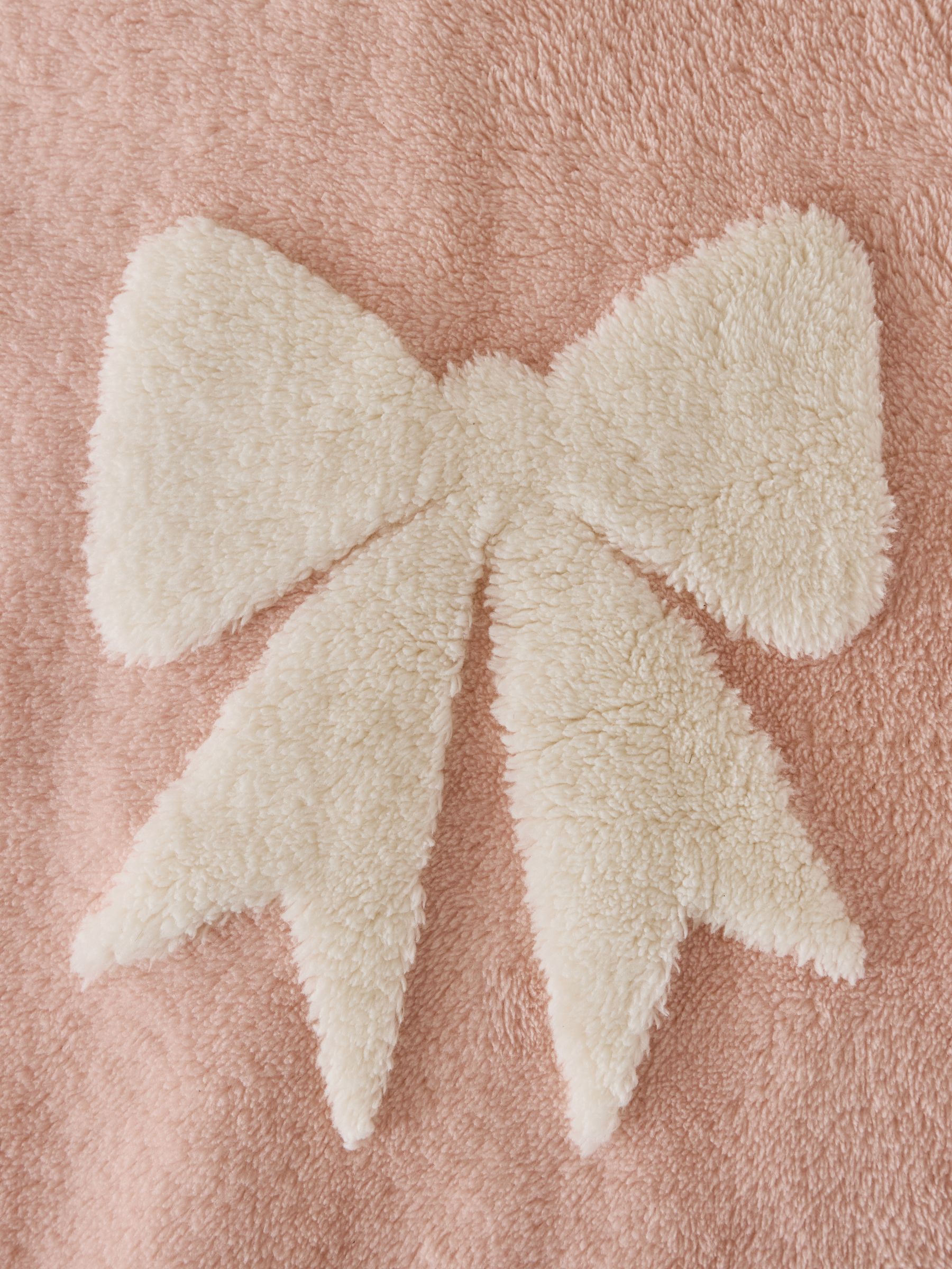 Buy Pink Carved Fleece Bows Throw from the Next UK online shop