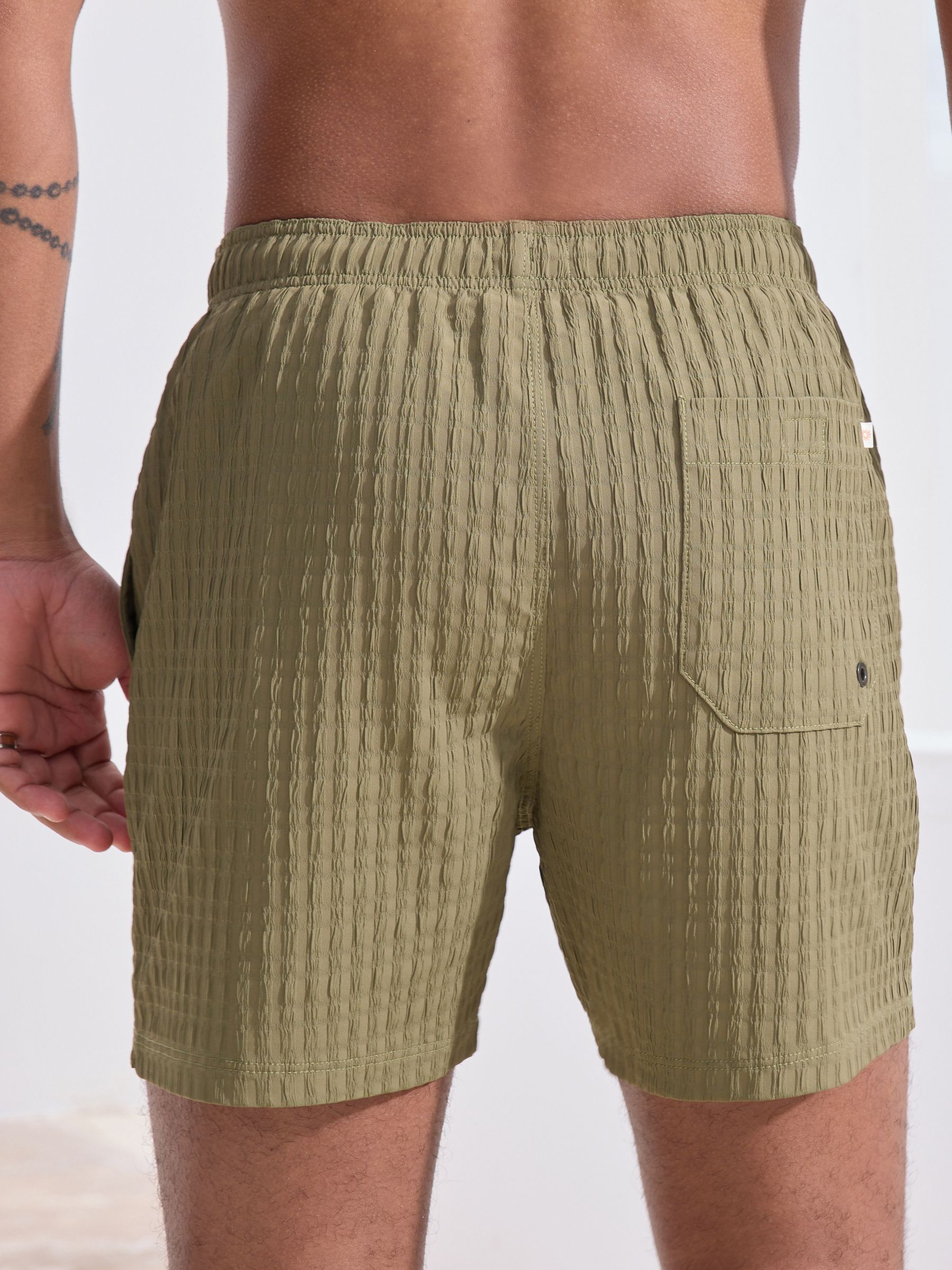 Buy Olive Green Waffle Textured Swim Shorts from the Next UK online shop