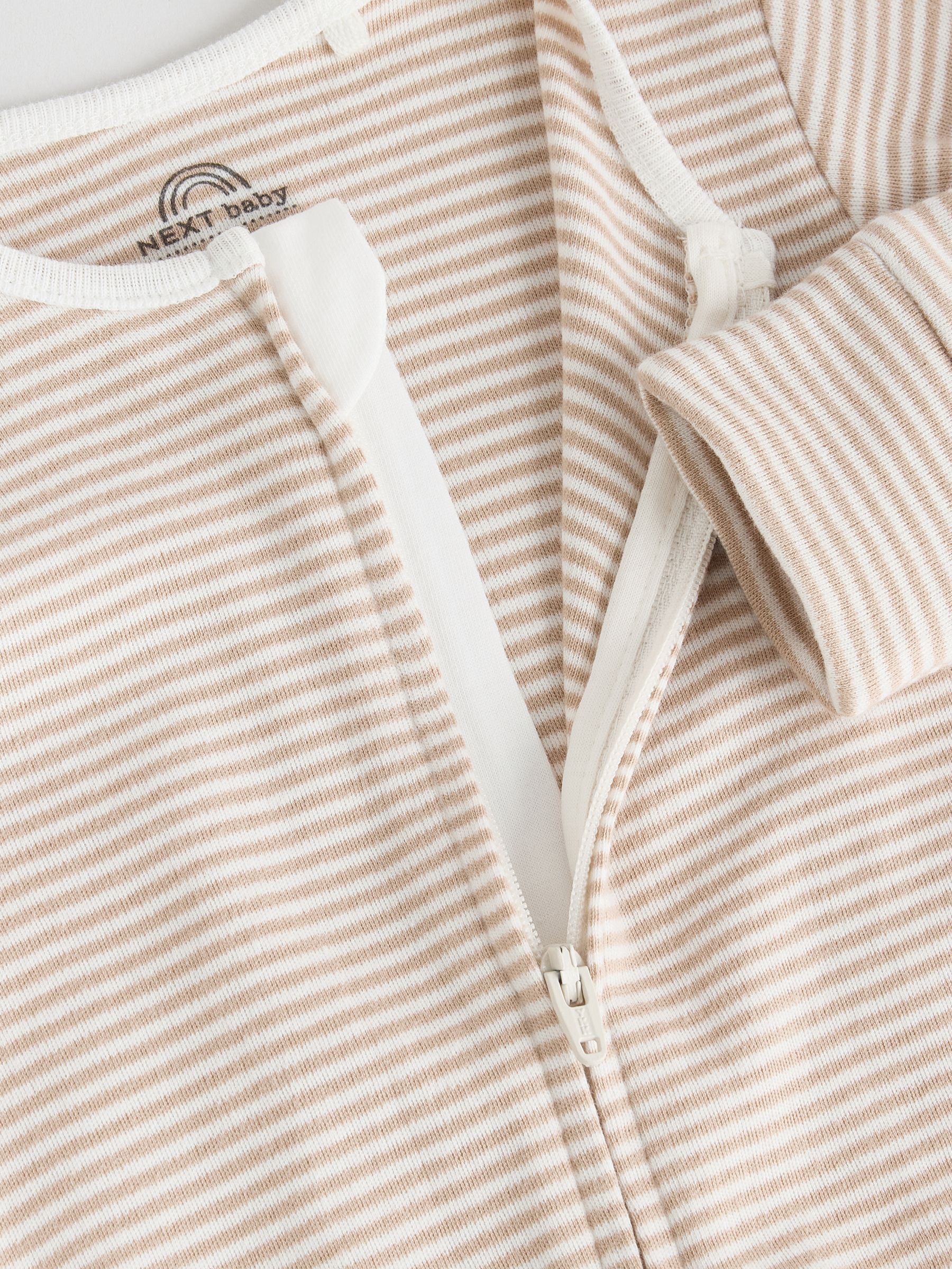 Buy Neutral 7 Pack Two Way Zip Baby Sleepsuits (0-2yrs) from the Next ...