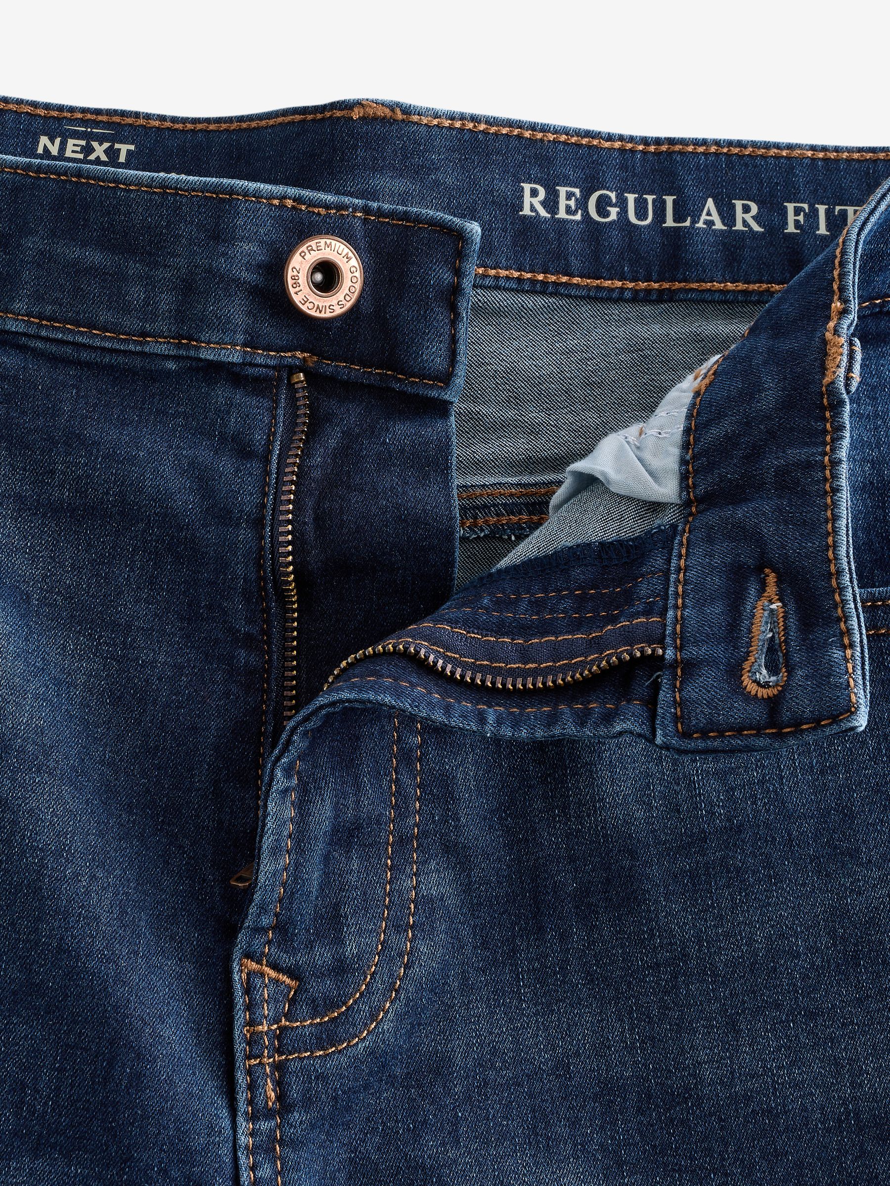 Buy Blue Mid Regular Tapered Fit Classic Stretch Jeans from Next Saudi ...