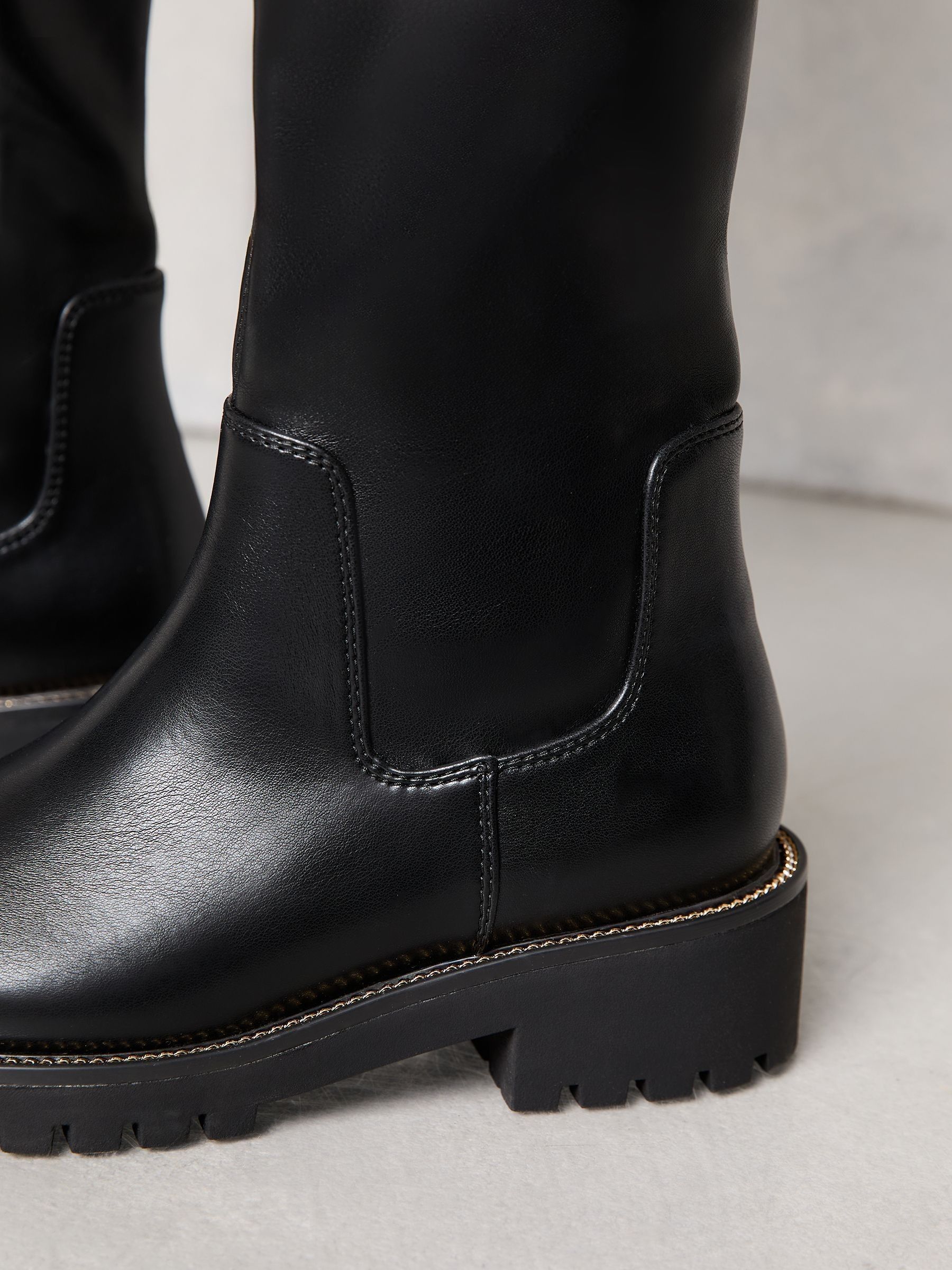Buy Lipsy Black Chunky Flat Knee High Stretch Faux Leather Boot from ...