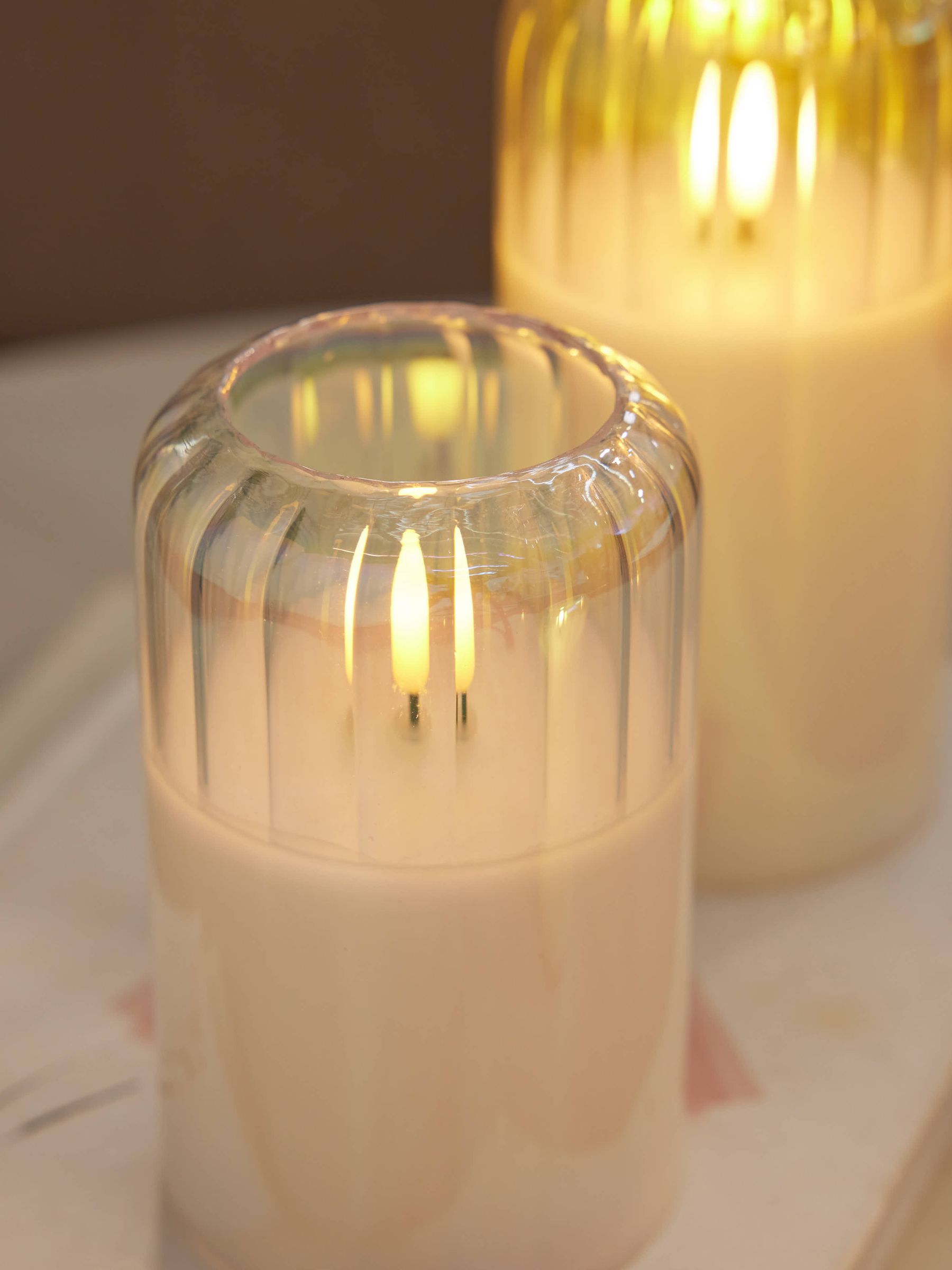 Buy Set of 3 Iridescent Glass Ribbed LED Pillar Candles from the Next ...