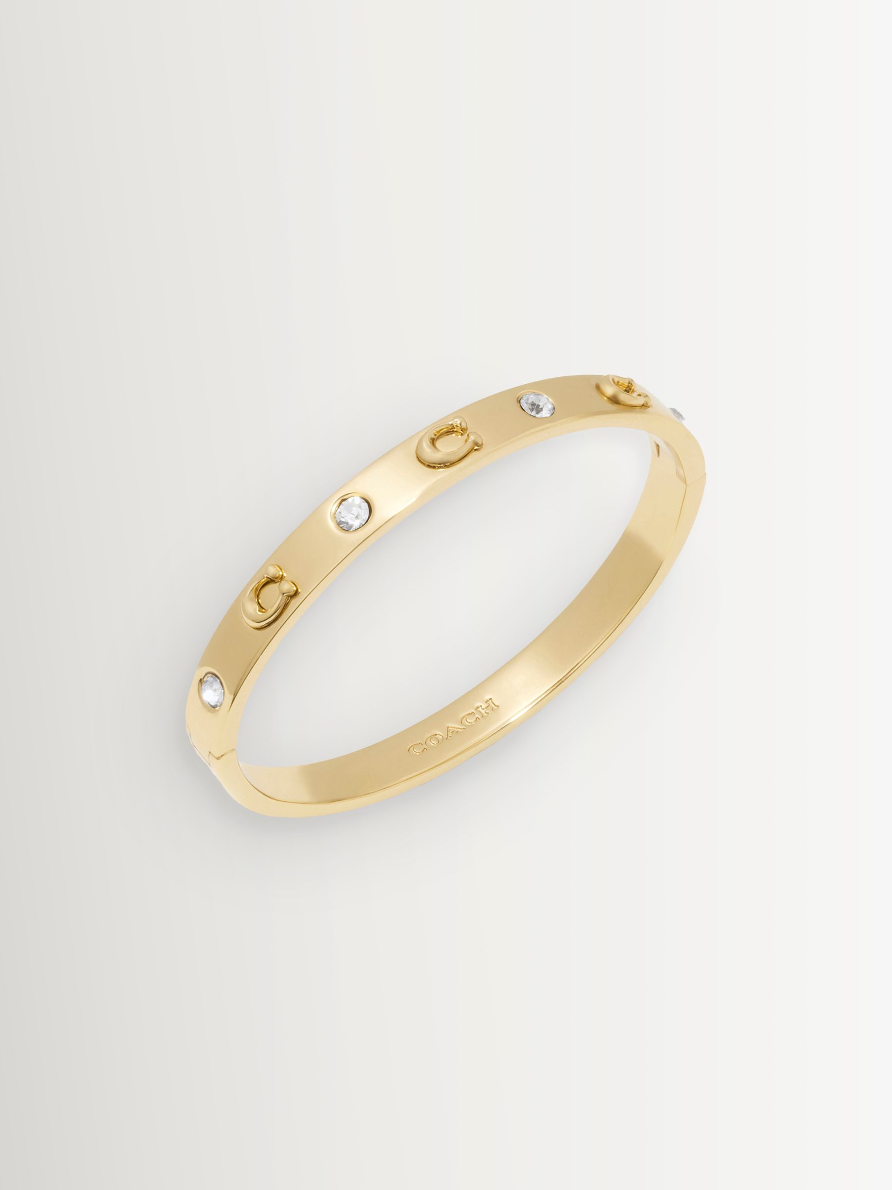 Buy COACH Gold Tone Signature Stone Bangle Boxed Bracelet from the Next ...