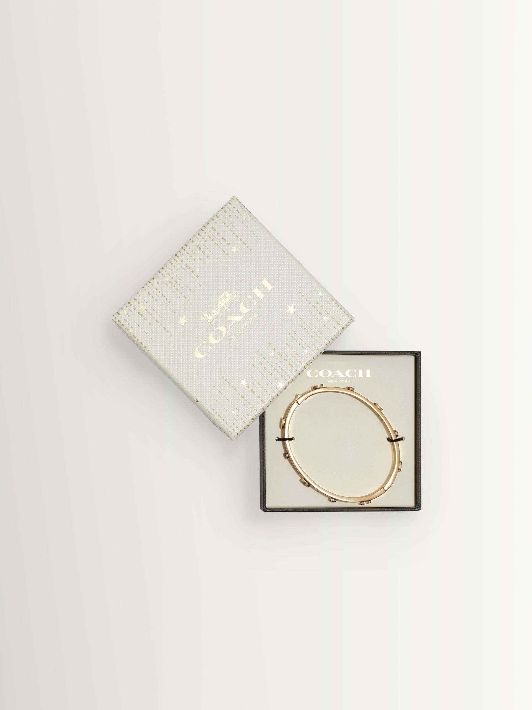 Buy COACH Gold Tone Signature Stone Bangle Boxed Bracelet from the Next ...