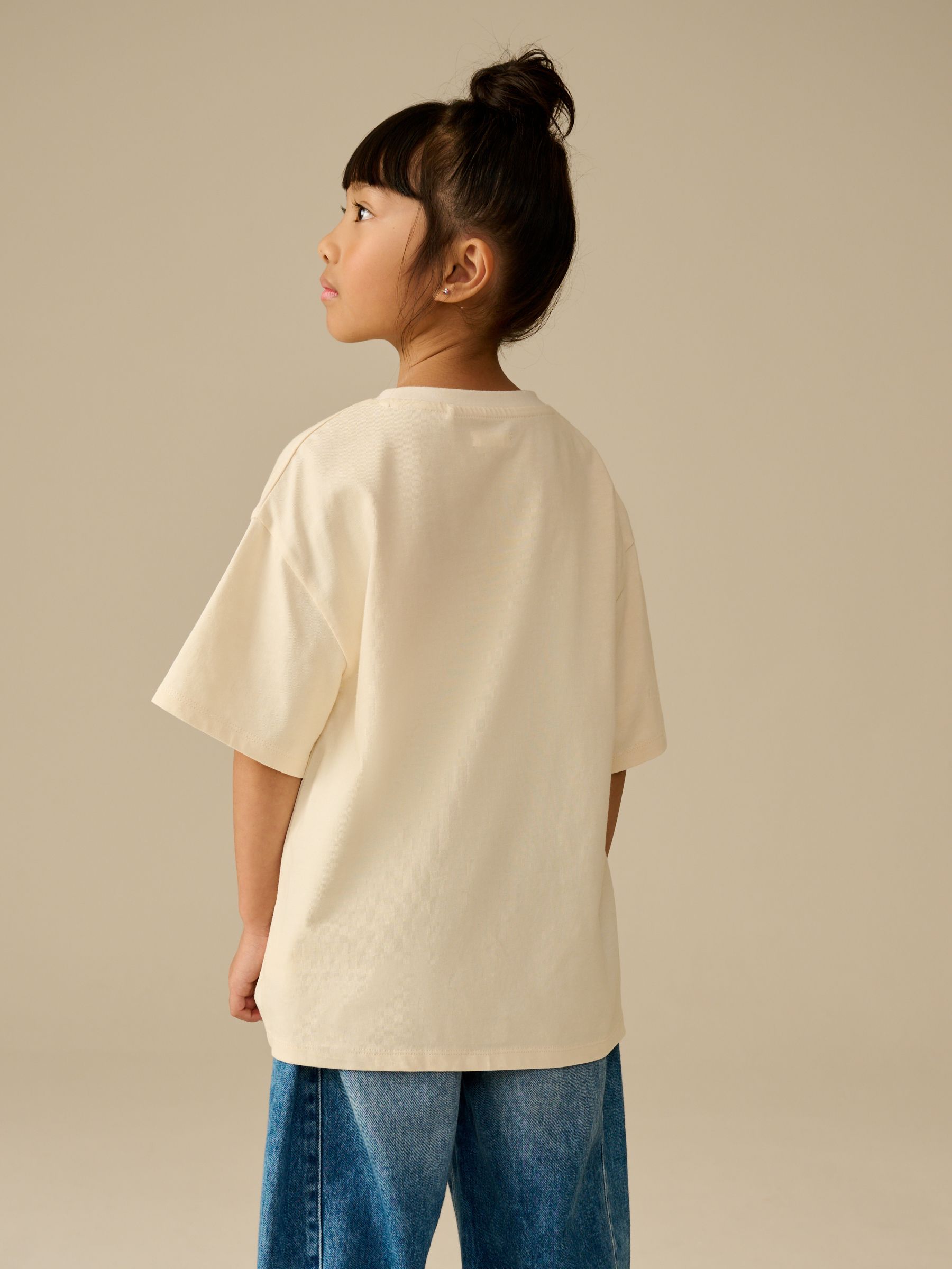 Buy Cream Oversized Graphic Print T-Shirt (3-16yrs) from the Next UK ...