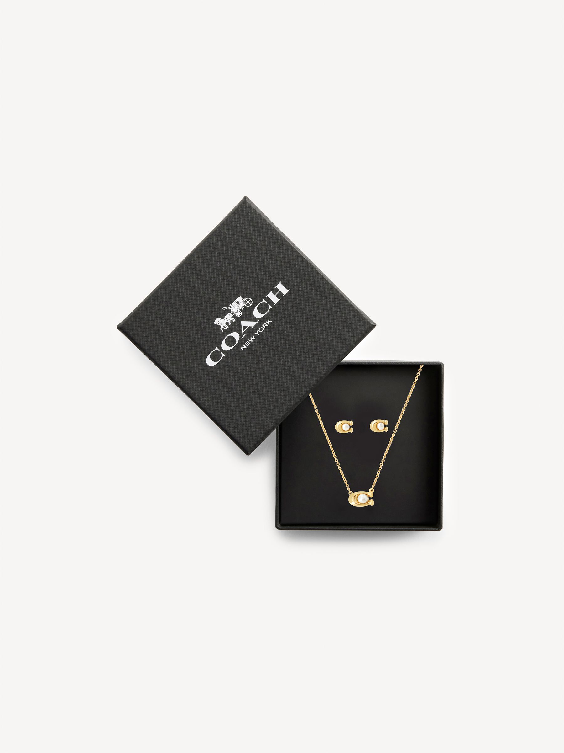 Buy COACH Gold Tone Signature Pearl Jewellery Set from the Next UK ...