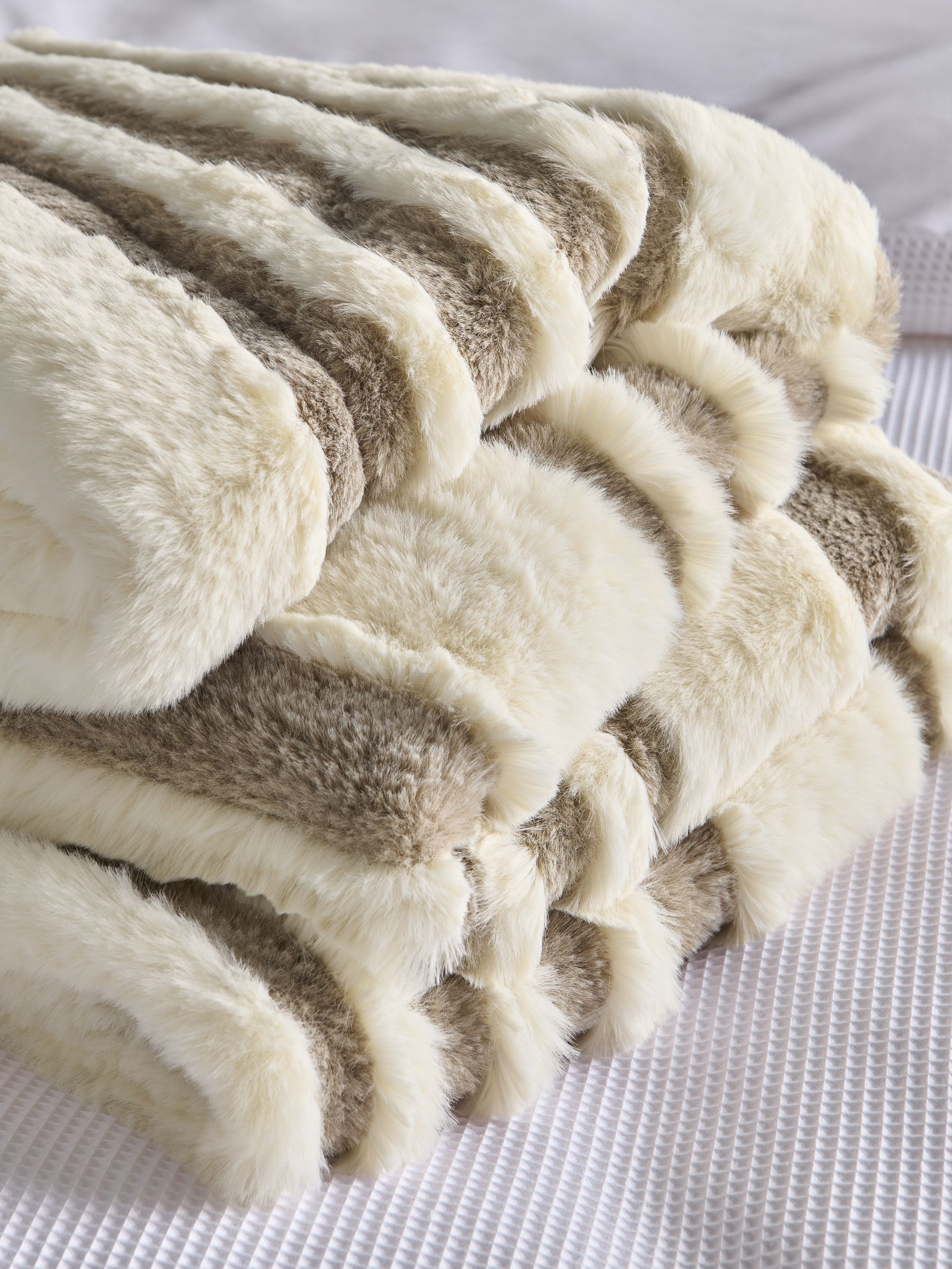 Buy Dark Natural Carved Stripe Faux Fur Throw from the Next UK online shop