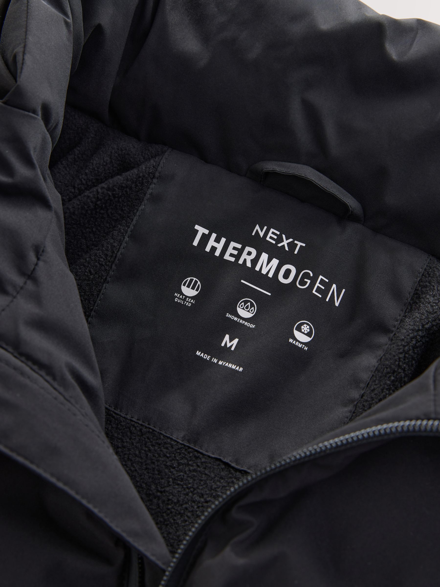 Buy Black ThermoGen Shower Resistant Puffer Jacket from the Next UK ...