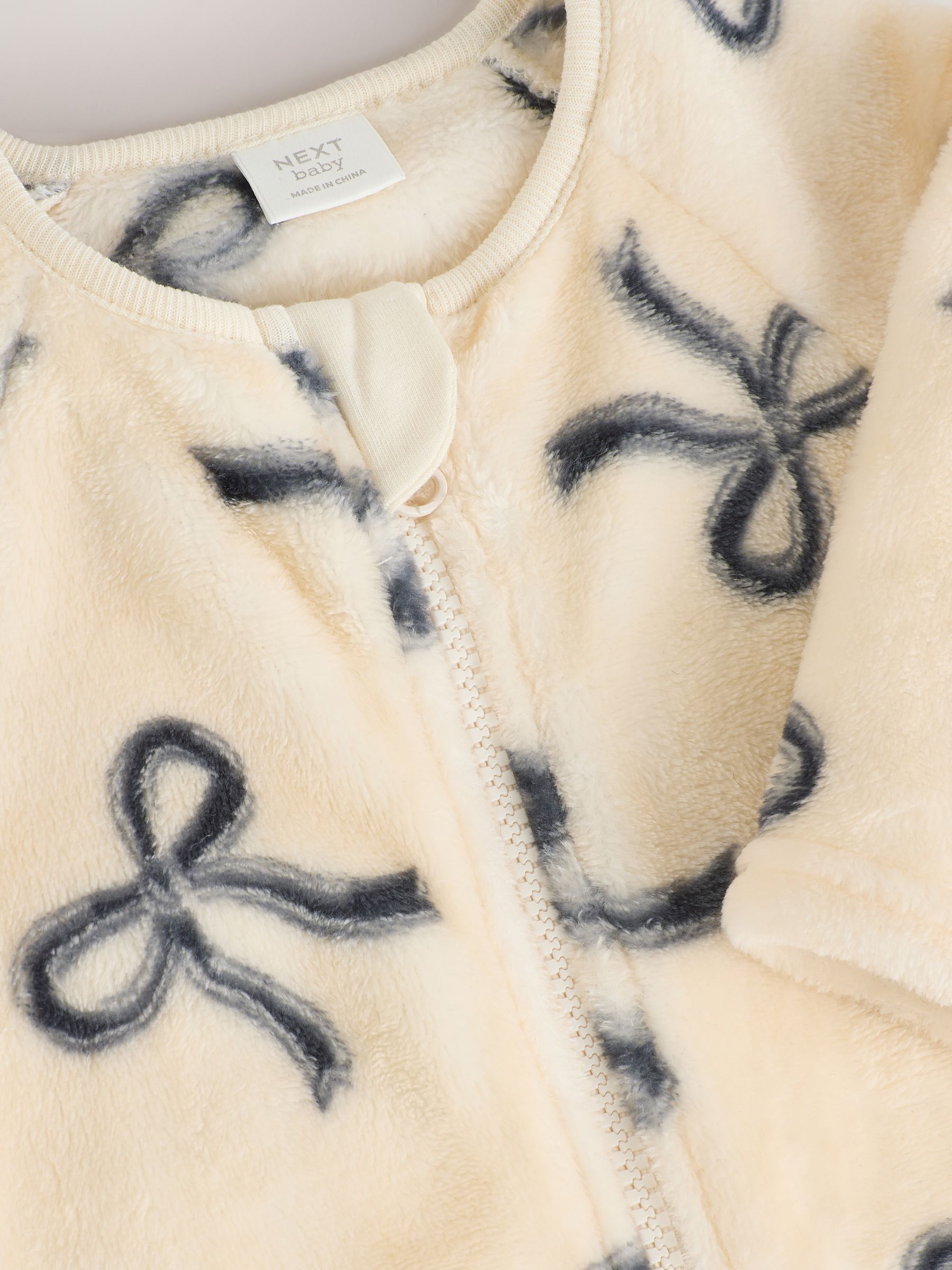 Buy Bow Baby Fleece Sleepsuit from the Next UK online shop