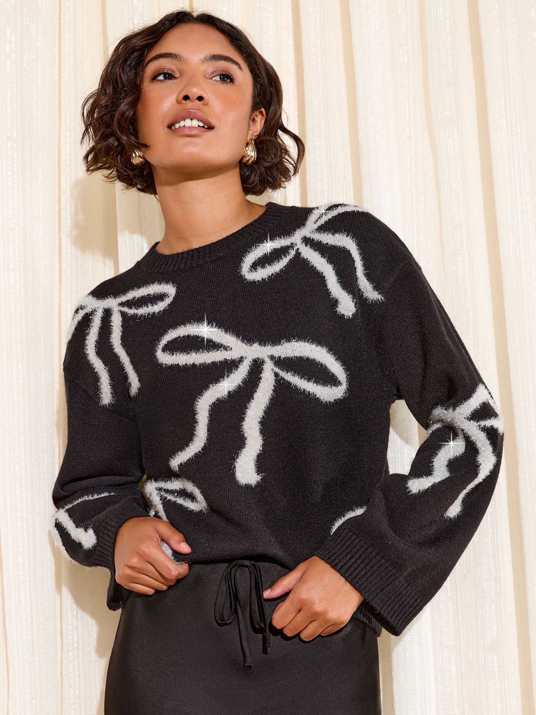 Buy Friends Like These Black All Over Tinsel Bow Christmas Jumper from ...
