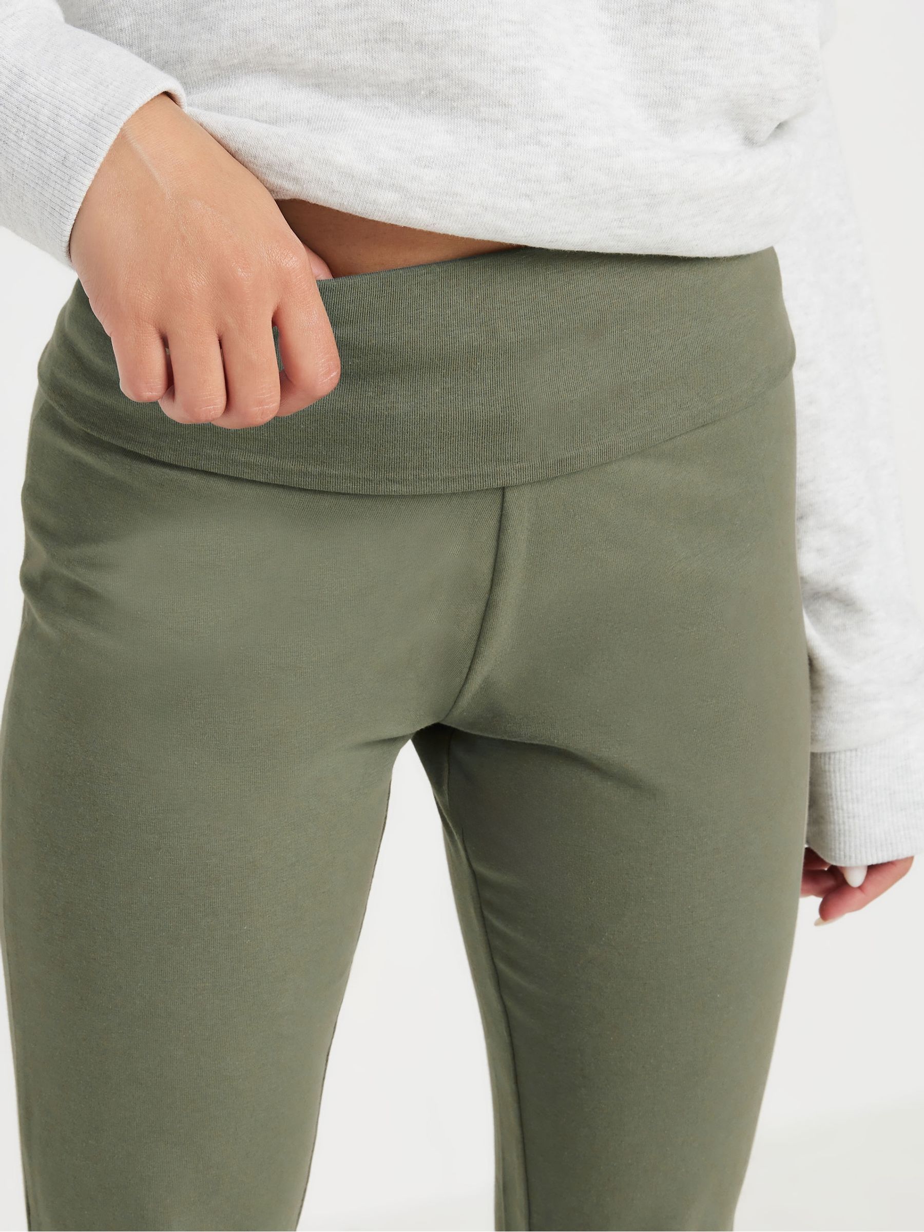 Buy PixieGirl Petite Green Fold Over Waist Flared Leggings from the ...