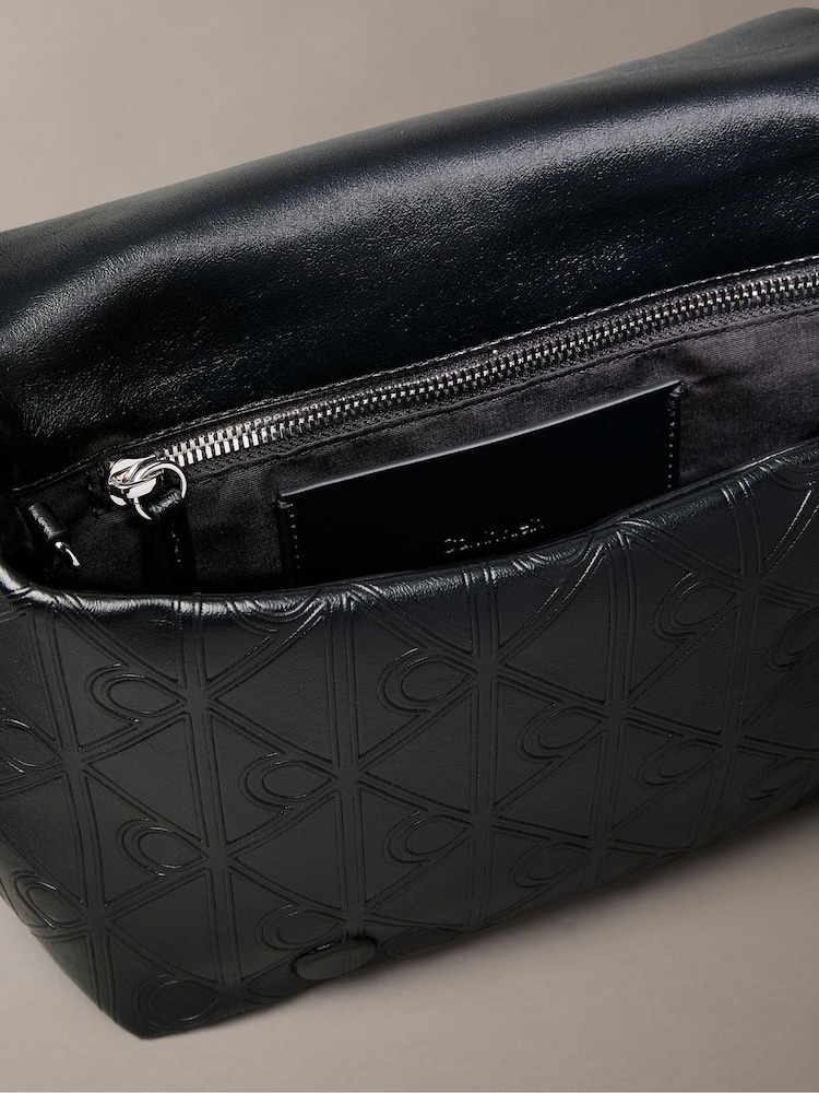 Buy Calvin Klein Black Puffer Emblem Logo Flap Cross-Body Bag from Next ...