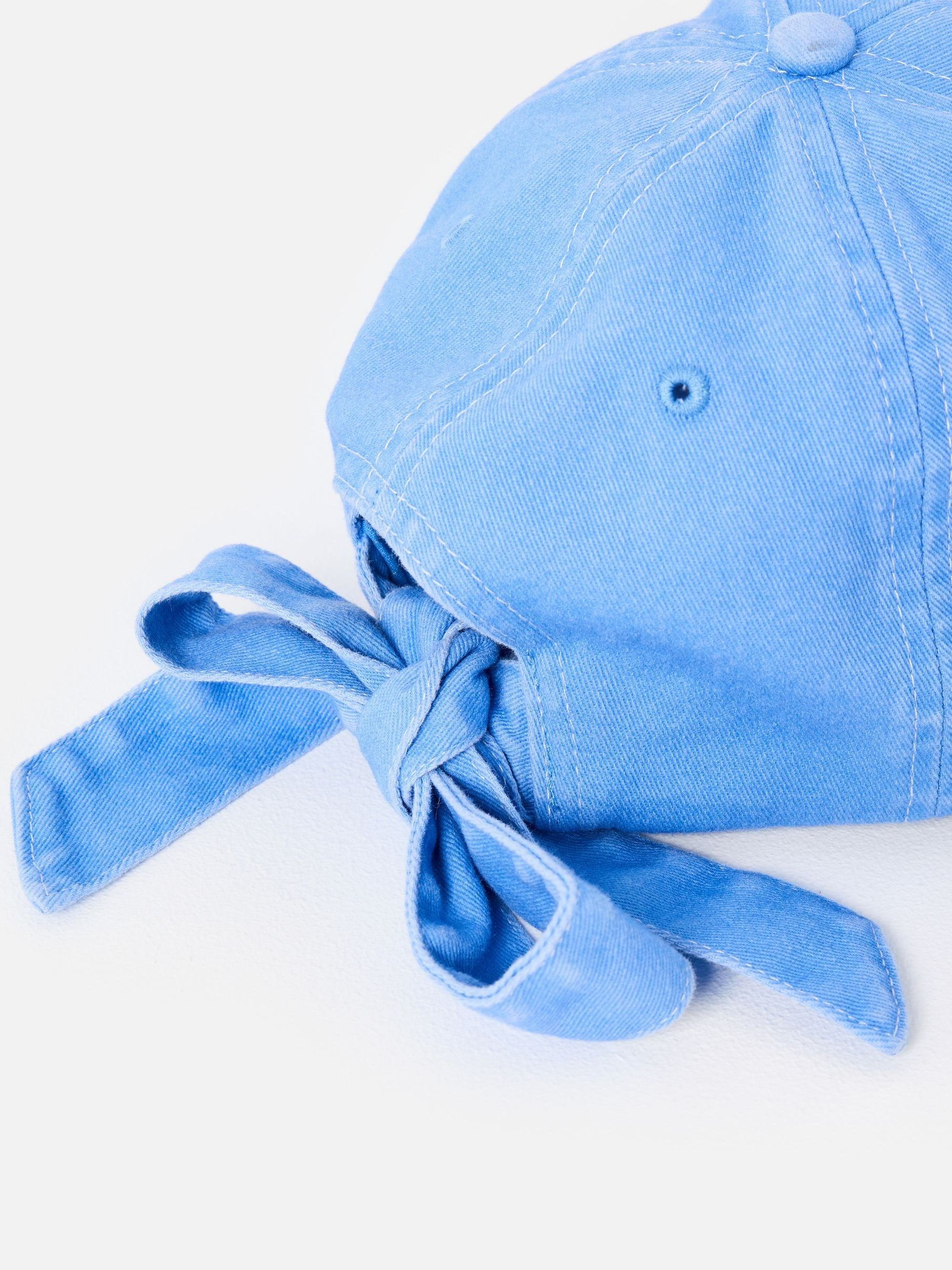 Buy Oliver Bonas Blue Washed Blue Bow Cap Hat from Next Ireland