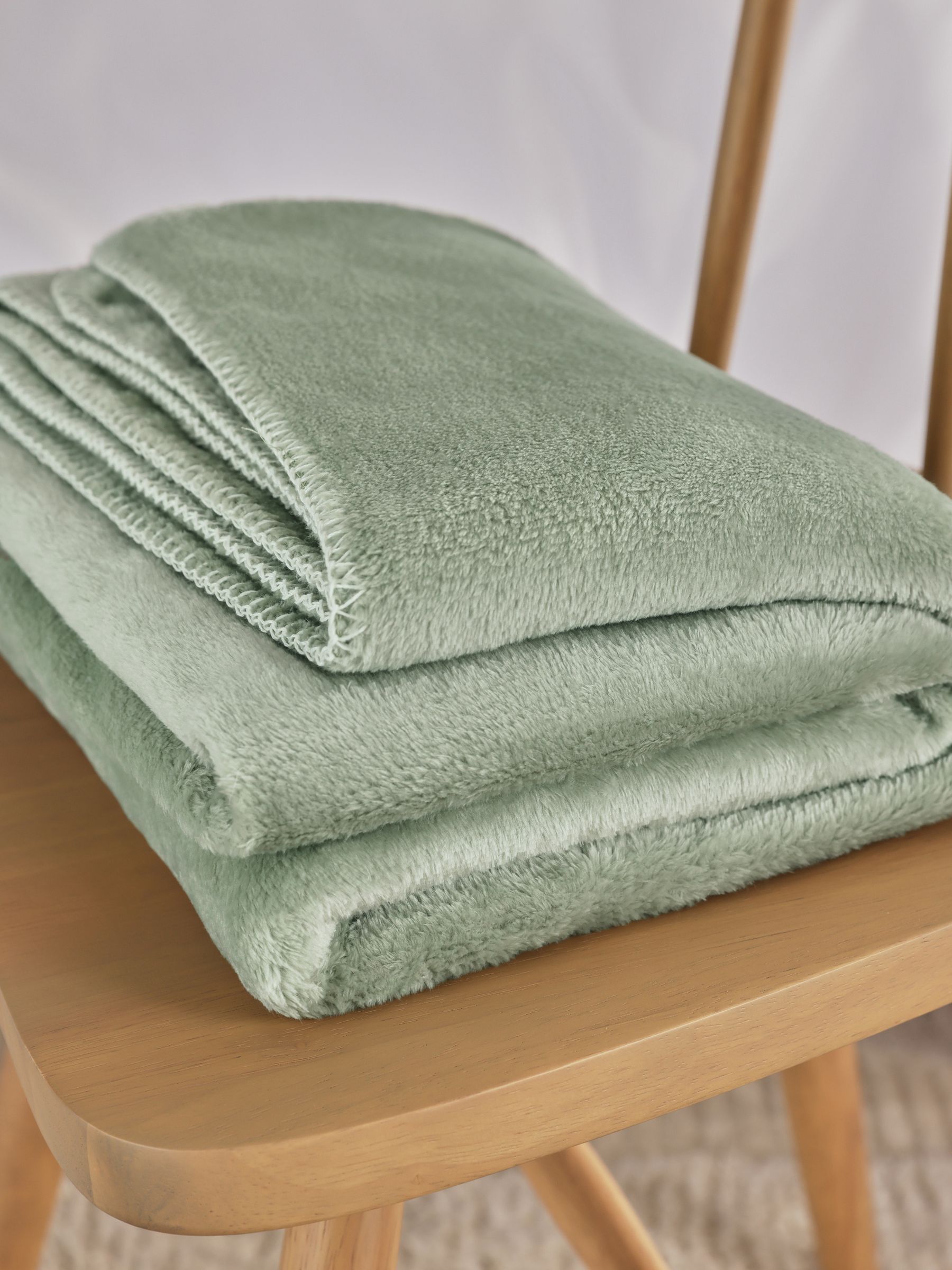 Buy Sage Green Plush Fleece Blanket Stitch Throw from the Next UK ...